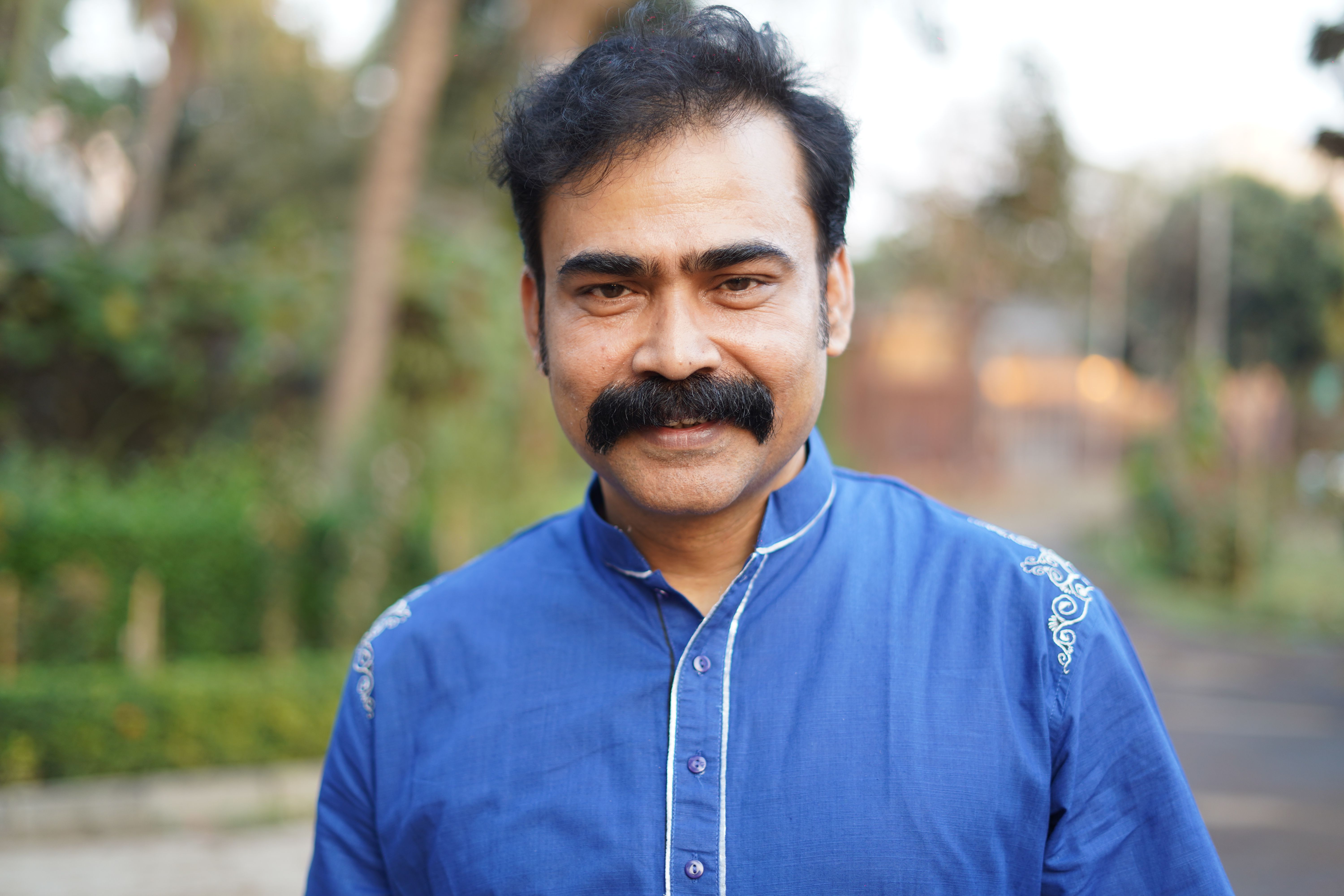 Smiling Man with a Mustache · Free Stock Photo