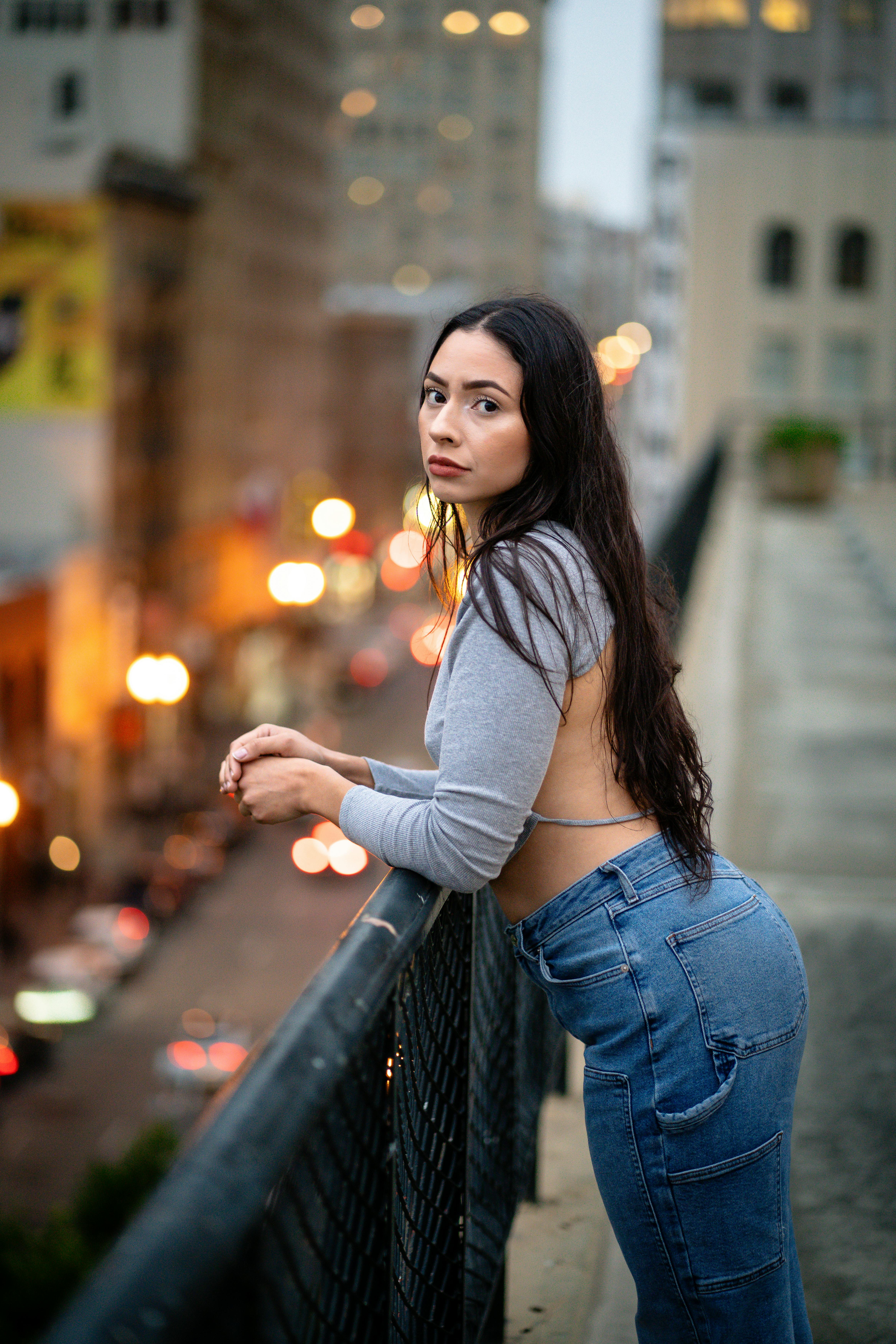 Woman Standing and Leaning on Railing · Free Stock Photo