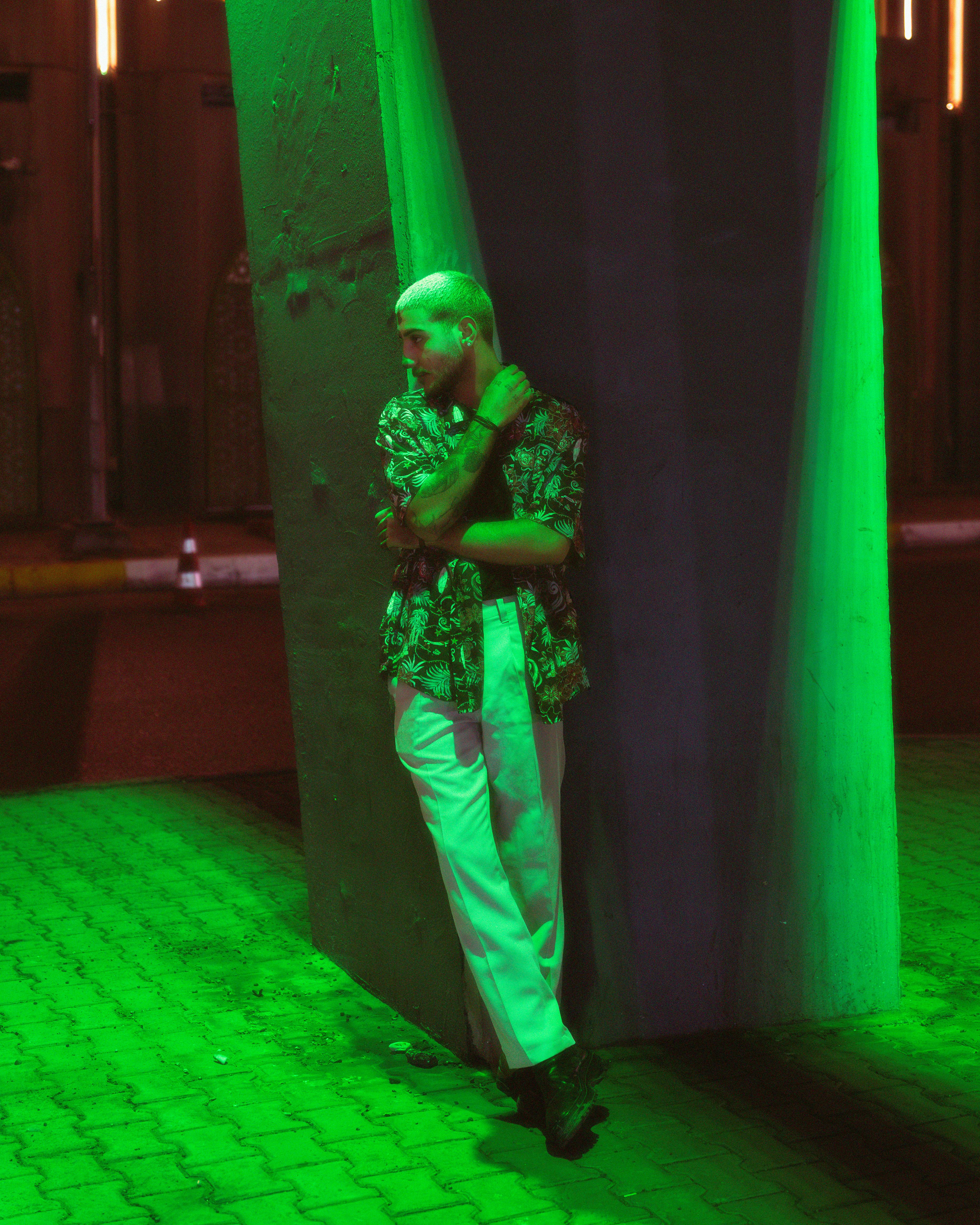 Man in Shirt Standing in Green Light · Free Stock Photo