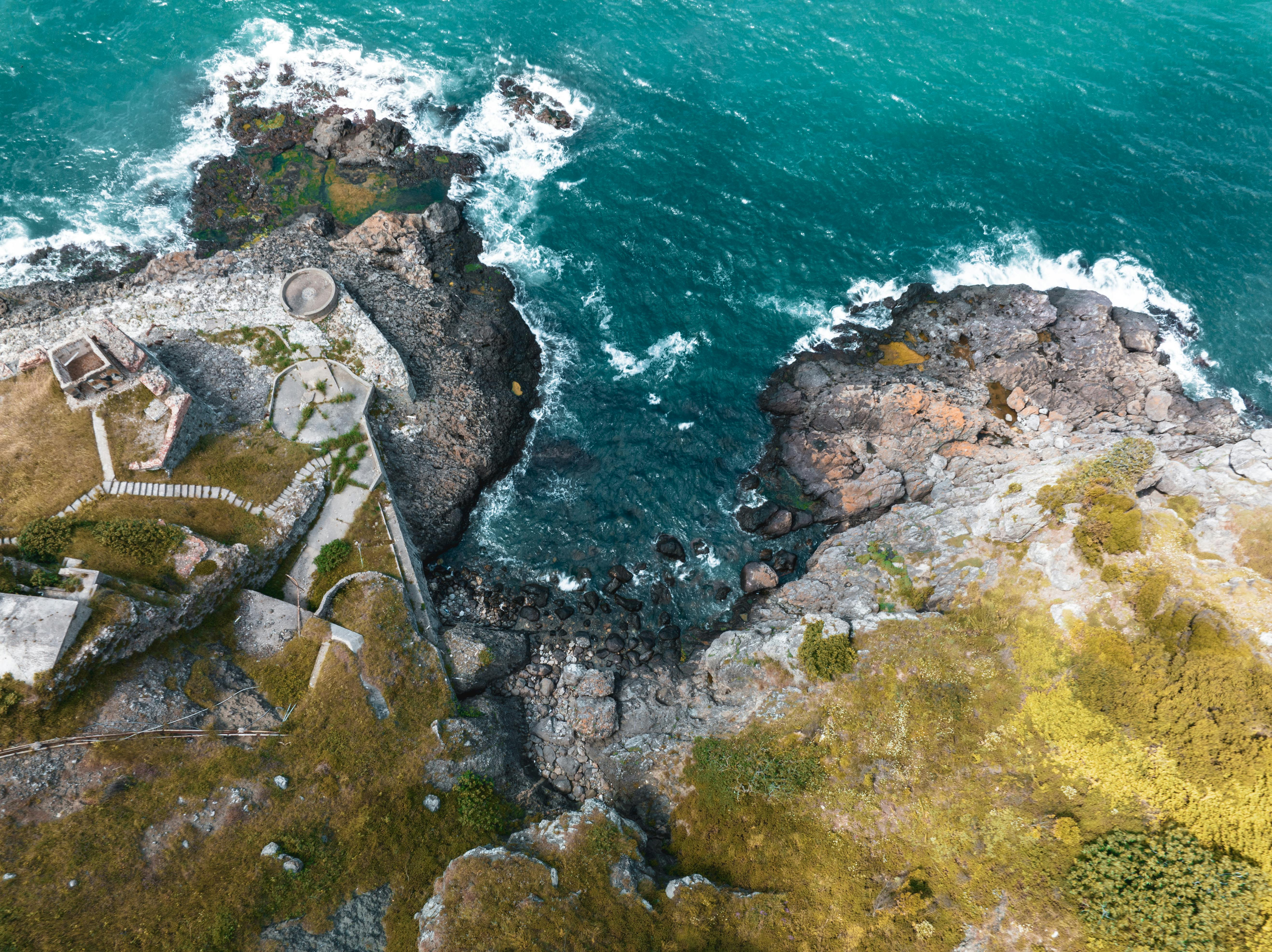 Top View of a Rocky Coast with Old Ruins · Free Stock Photo