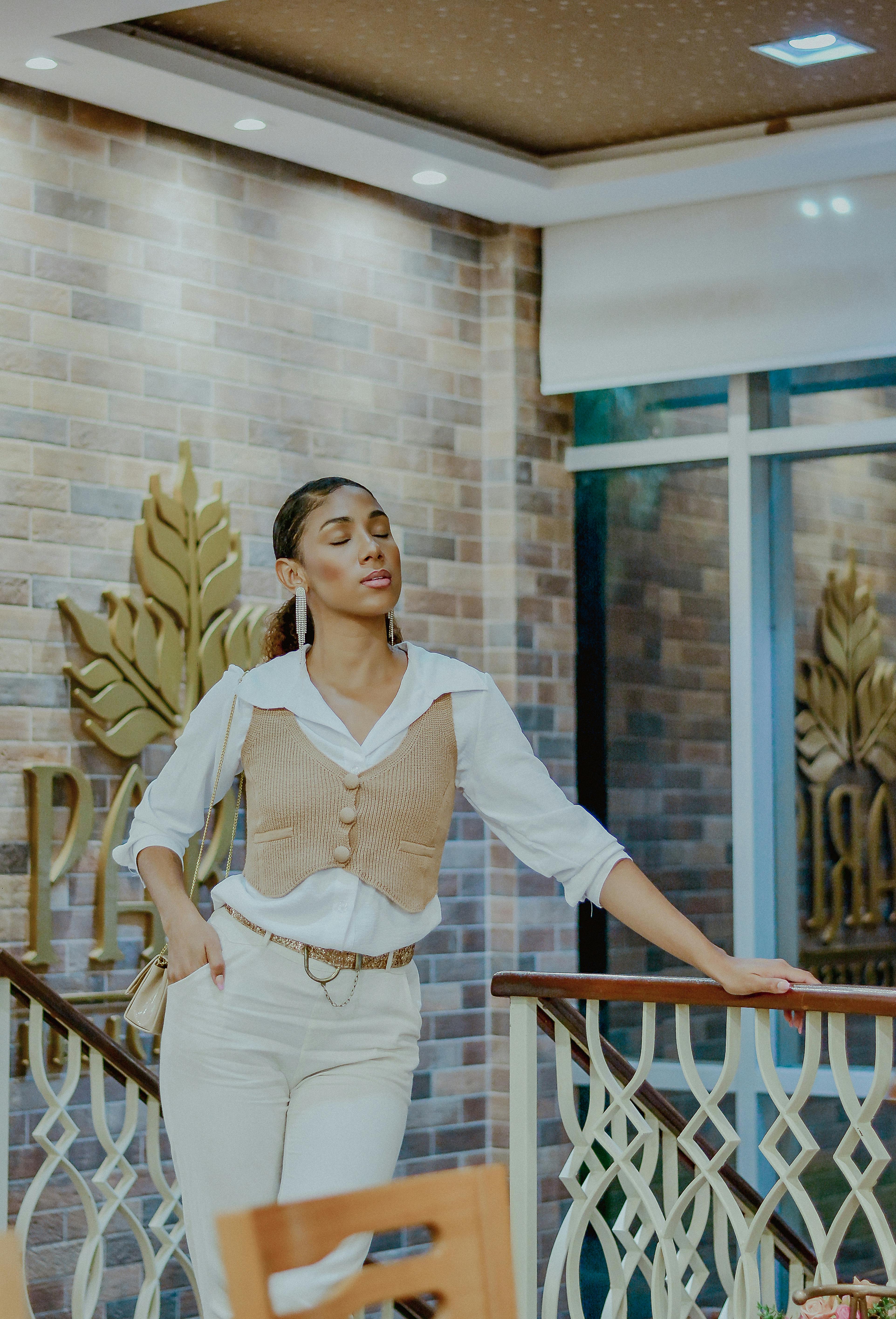 Woman Leaning on Handrail · Free Stock Photo