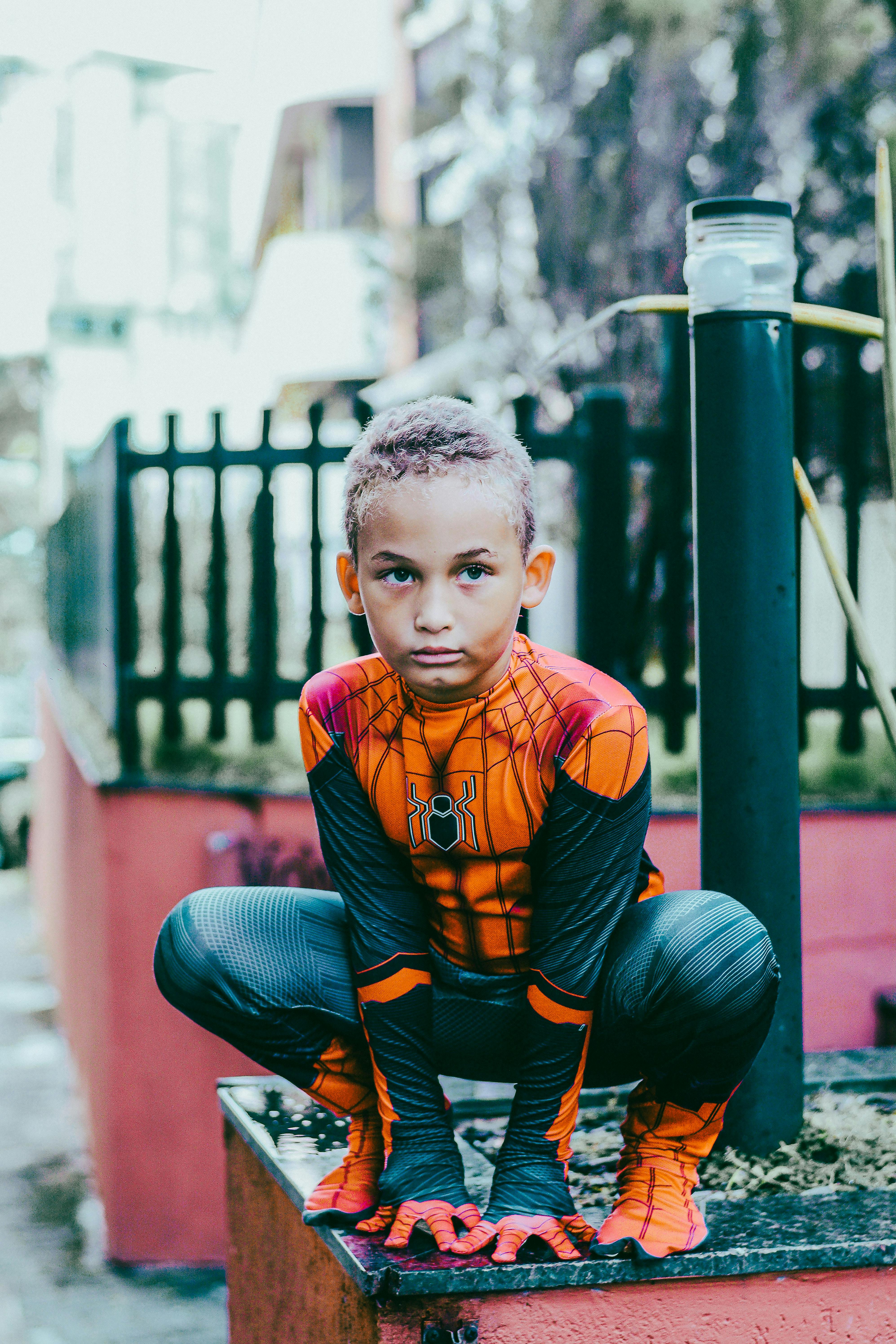 Boy Squatting in Spiderman Costume · Free Stock Photo