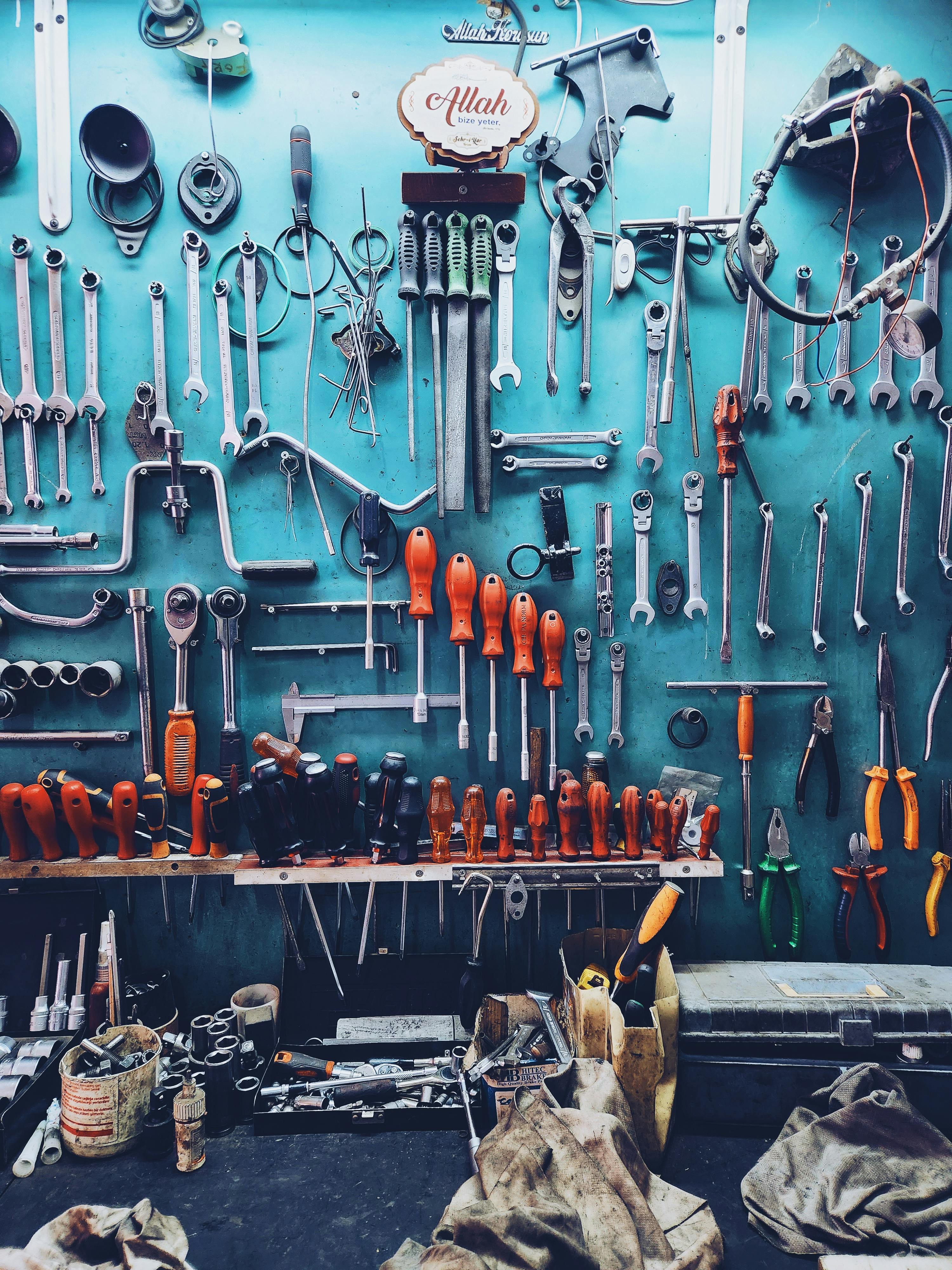 Wall and Desk in the Workshop with Sorted Tools · Free Stock Photo
