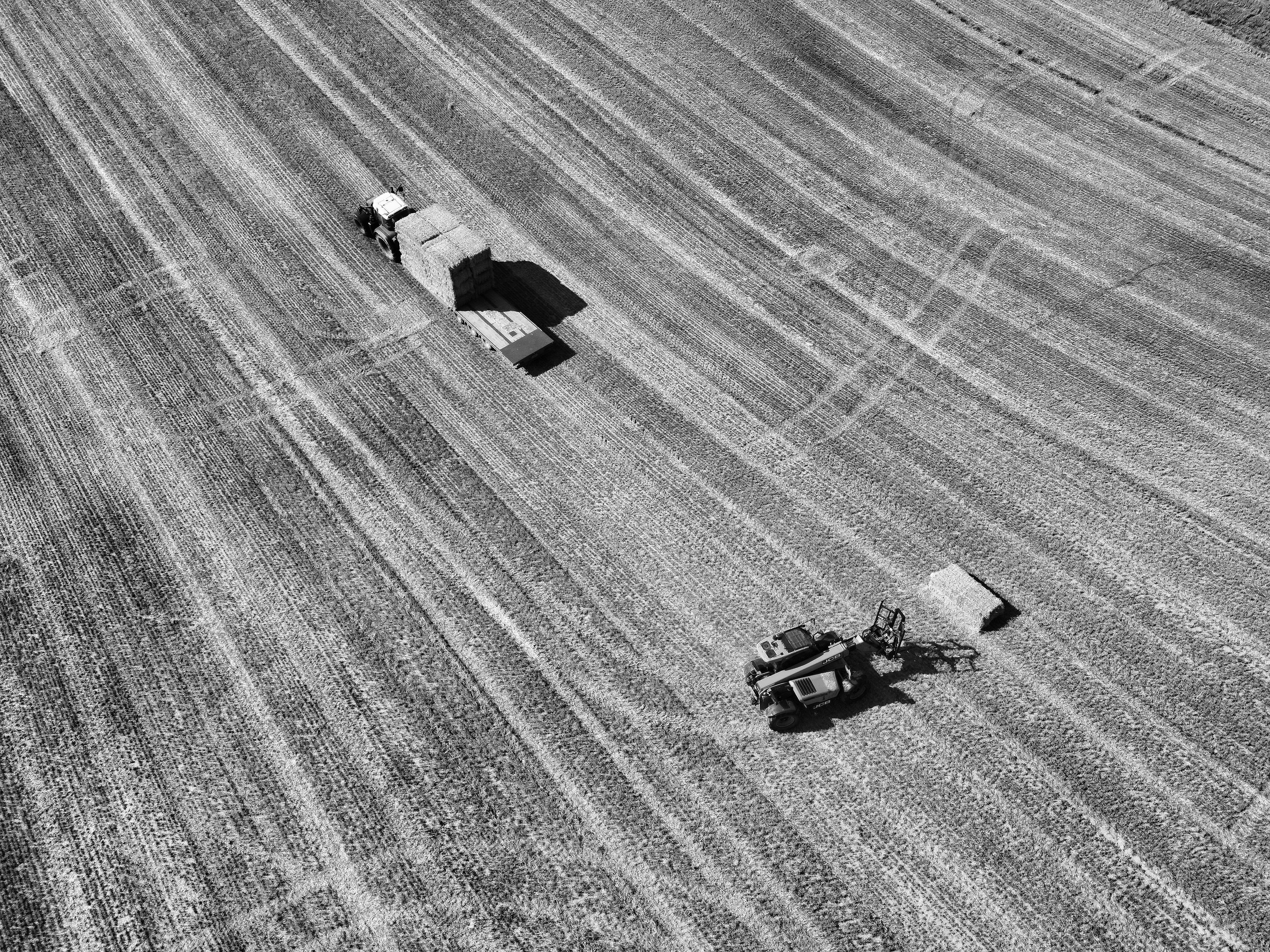 Aerial Photography of a Tractor and Farming Machinery in the Field ...