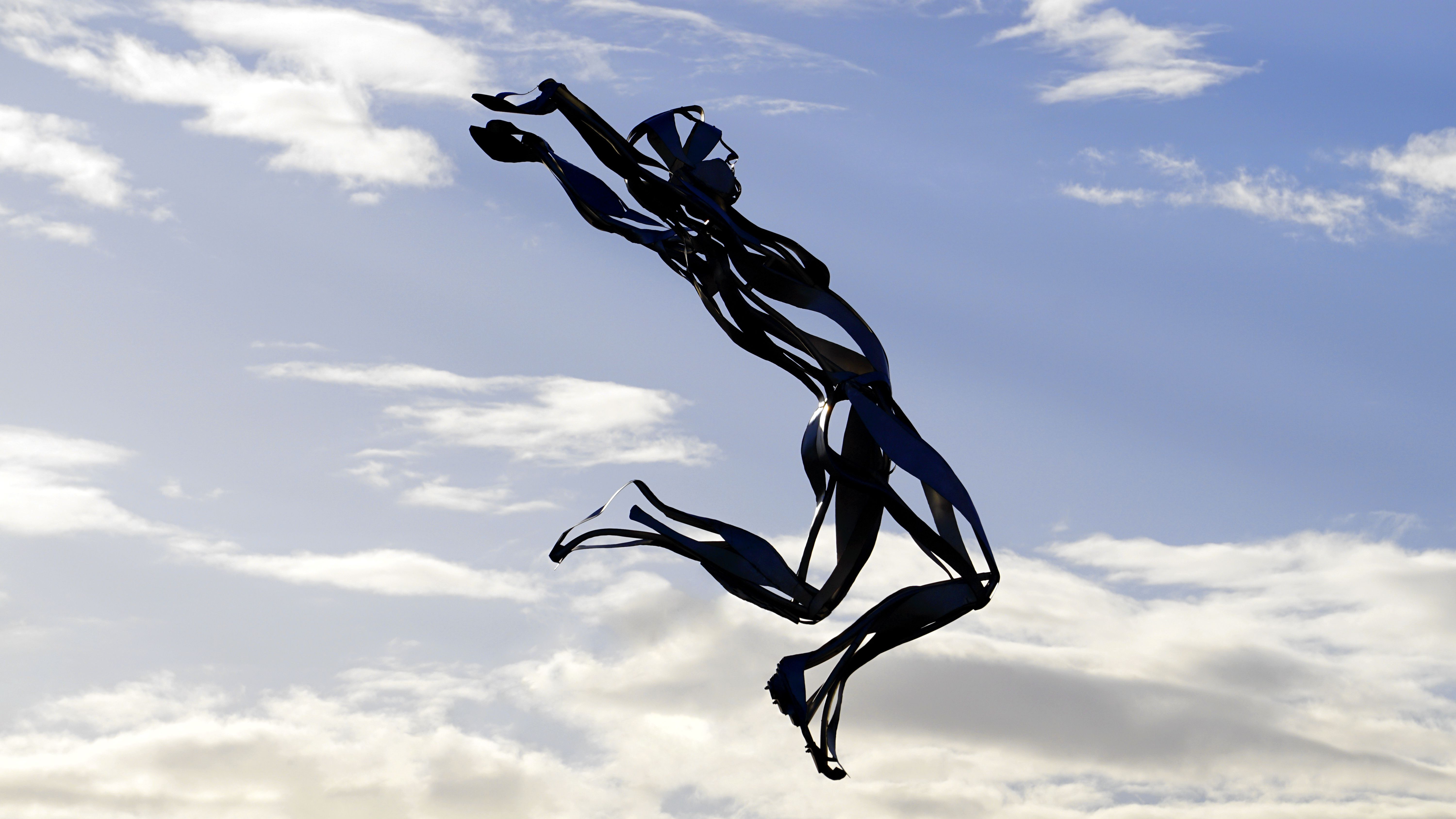 Black and Clear Human Form With Blue Sky and White Clouds Background ...