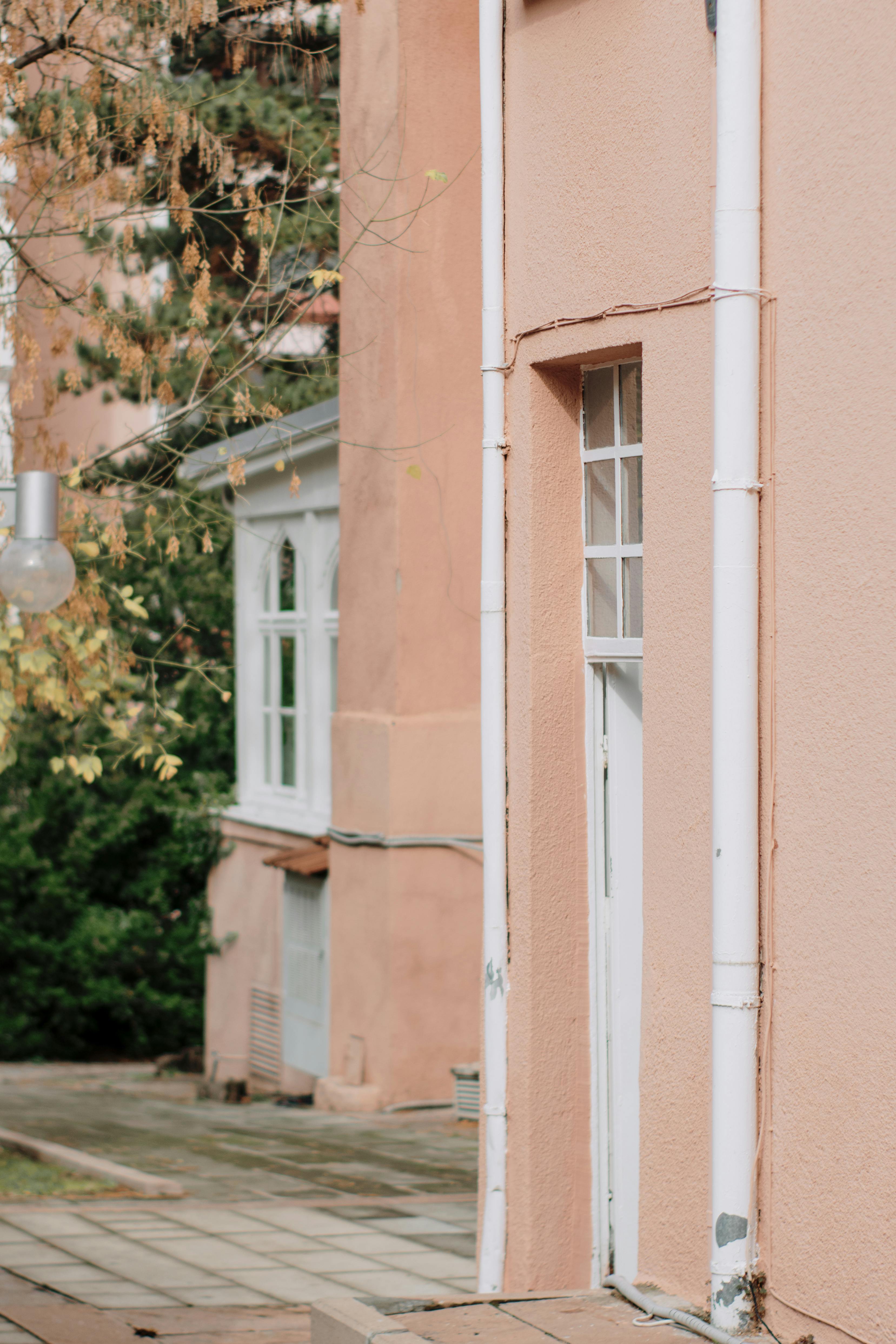 Gutters on Building Wall · Free Stock Photo