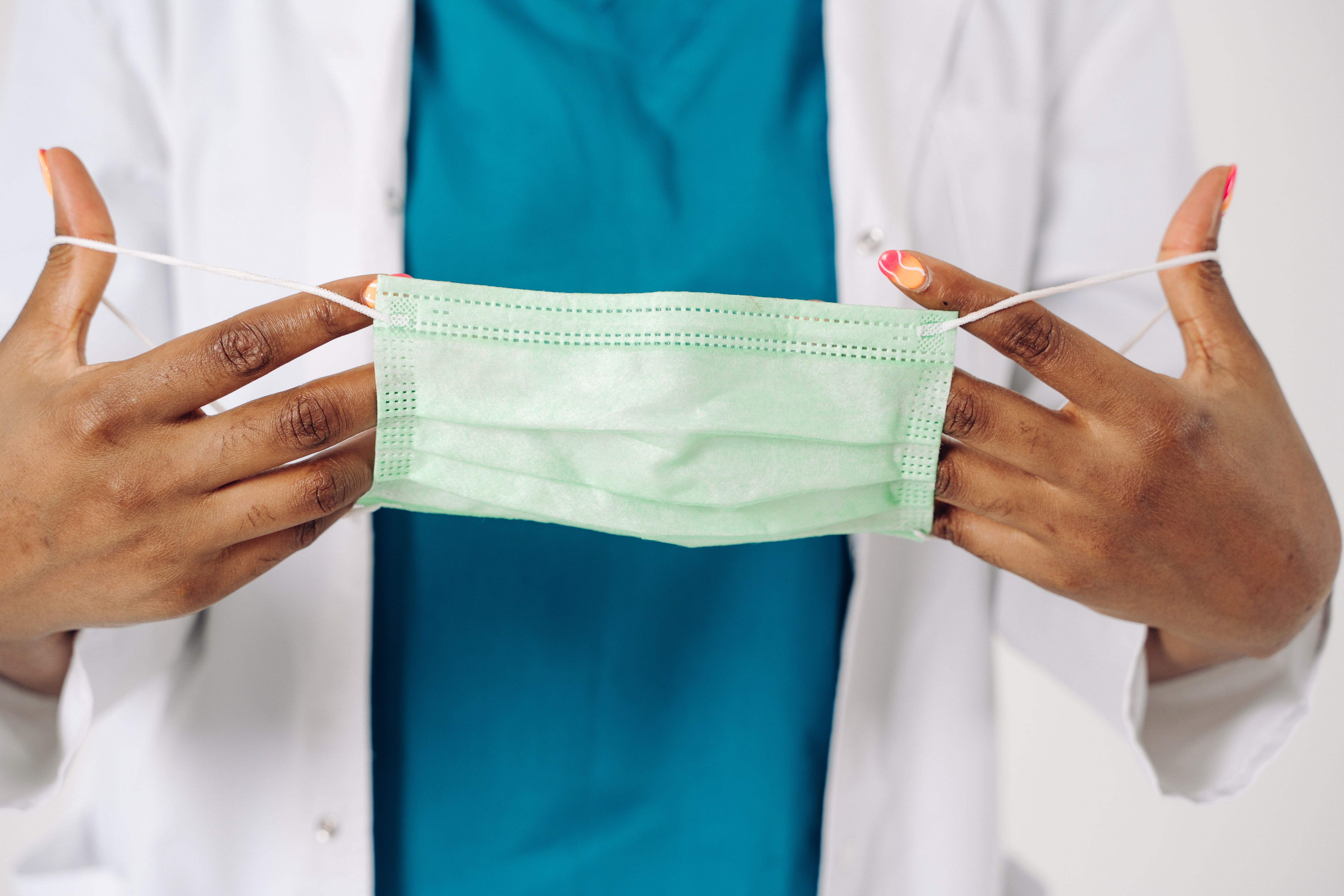 Doctor Holding Face Mask · Free Stock Photo