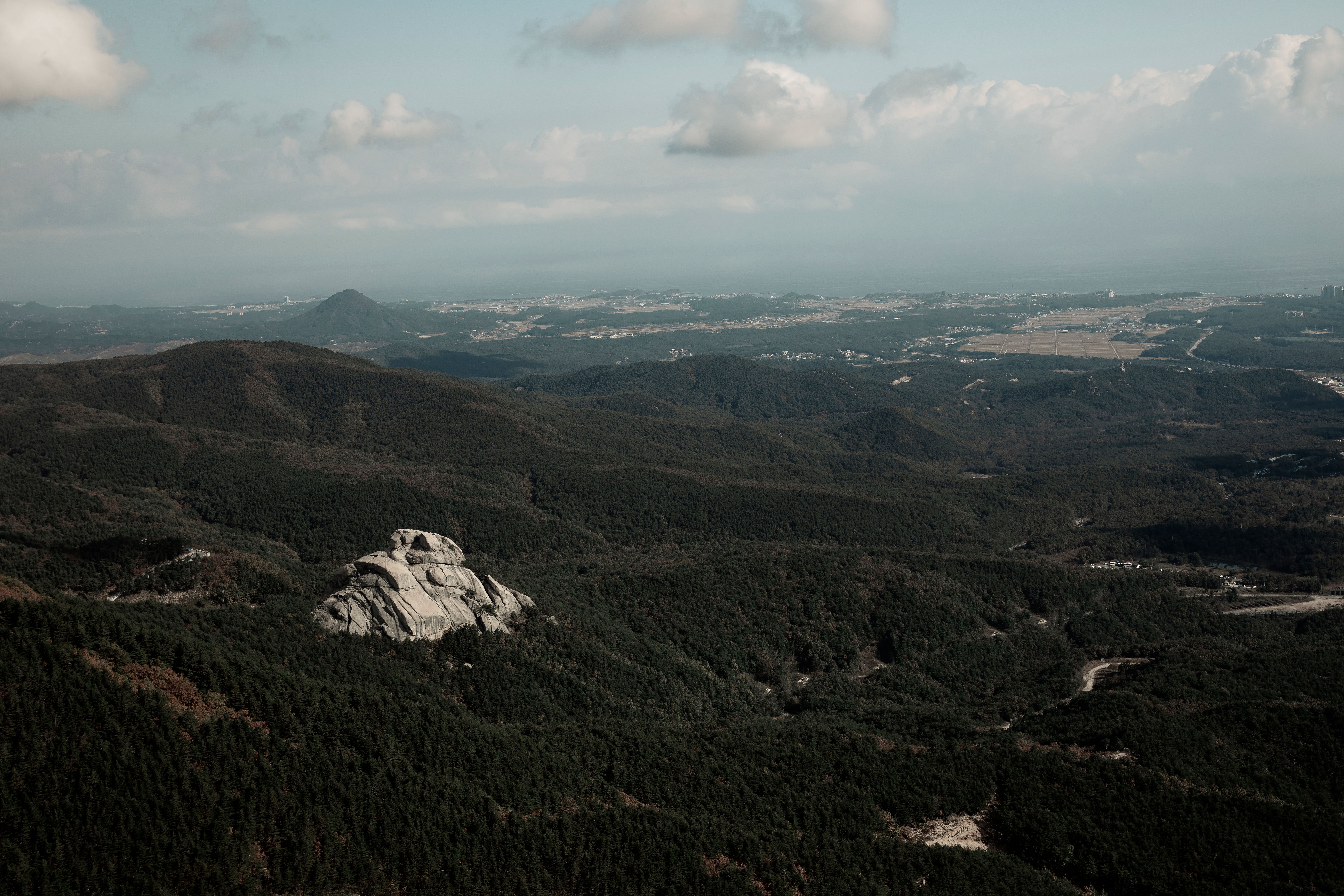 Rock Formation in Covered by Coniferous Forest Mountains · Free Stock Photo