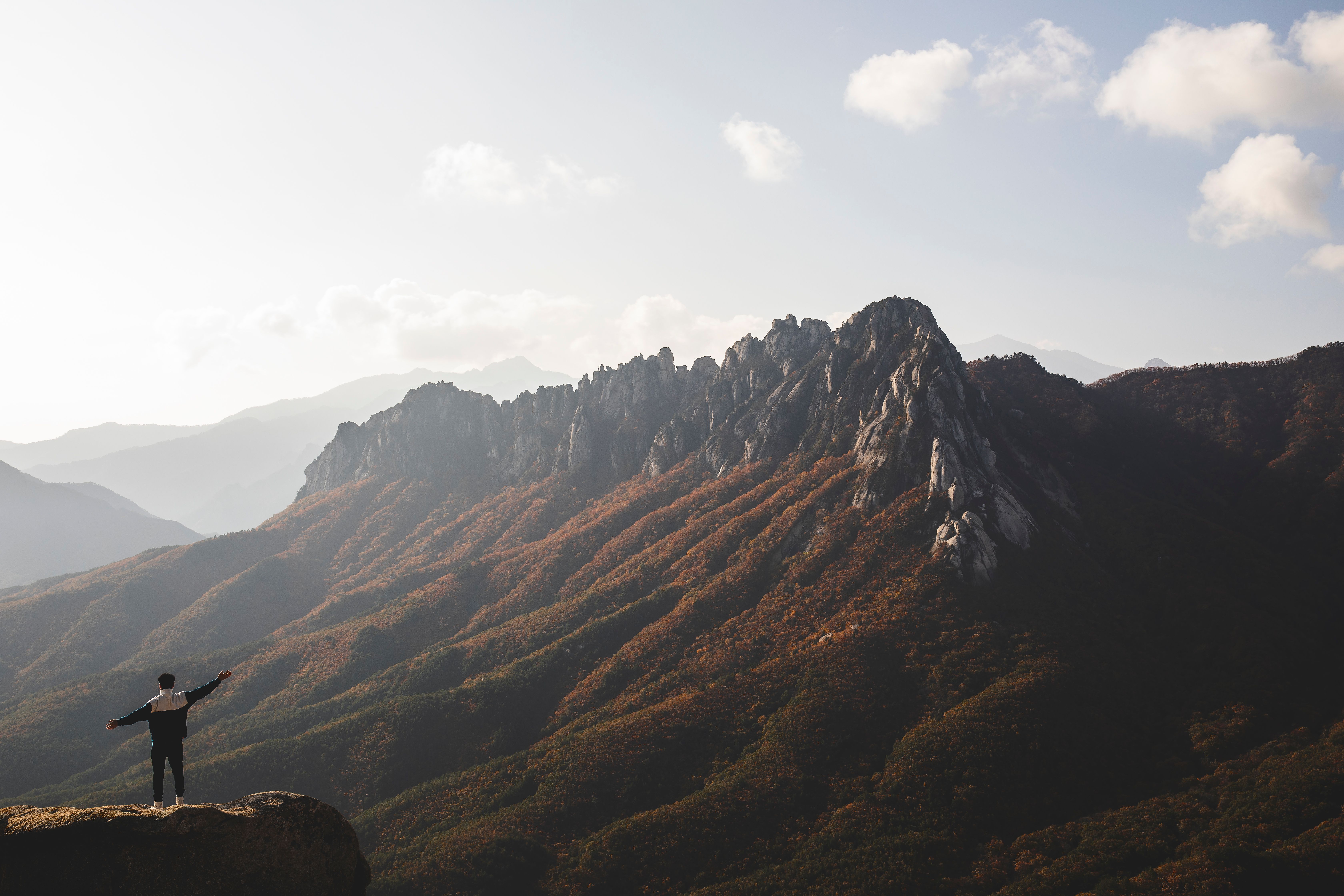 Closeup Photo of Person's Foot Near Mountain · Free Stock Photo