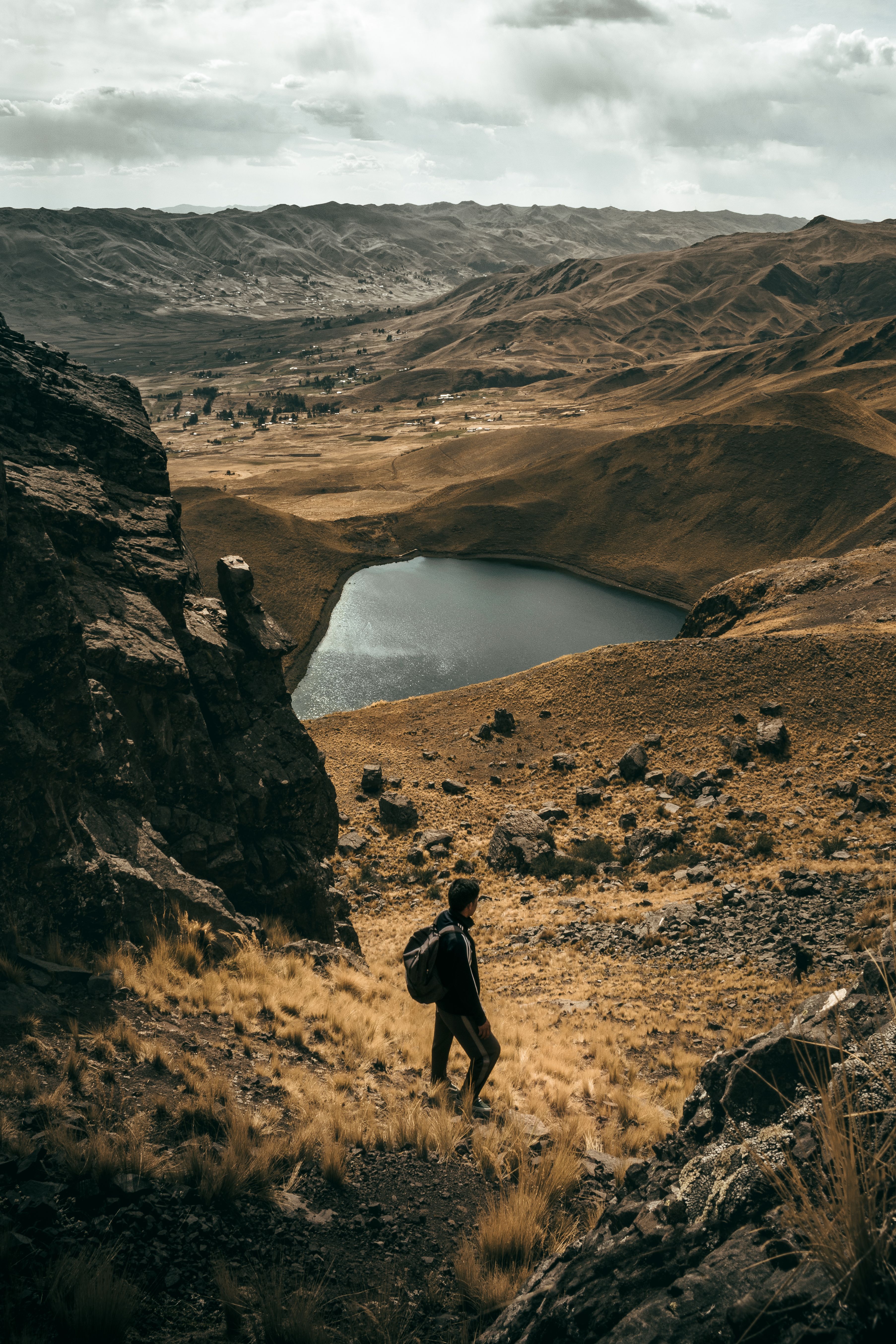 Man Hiking Alone on Hillside · Free Stock Photo