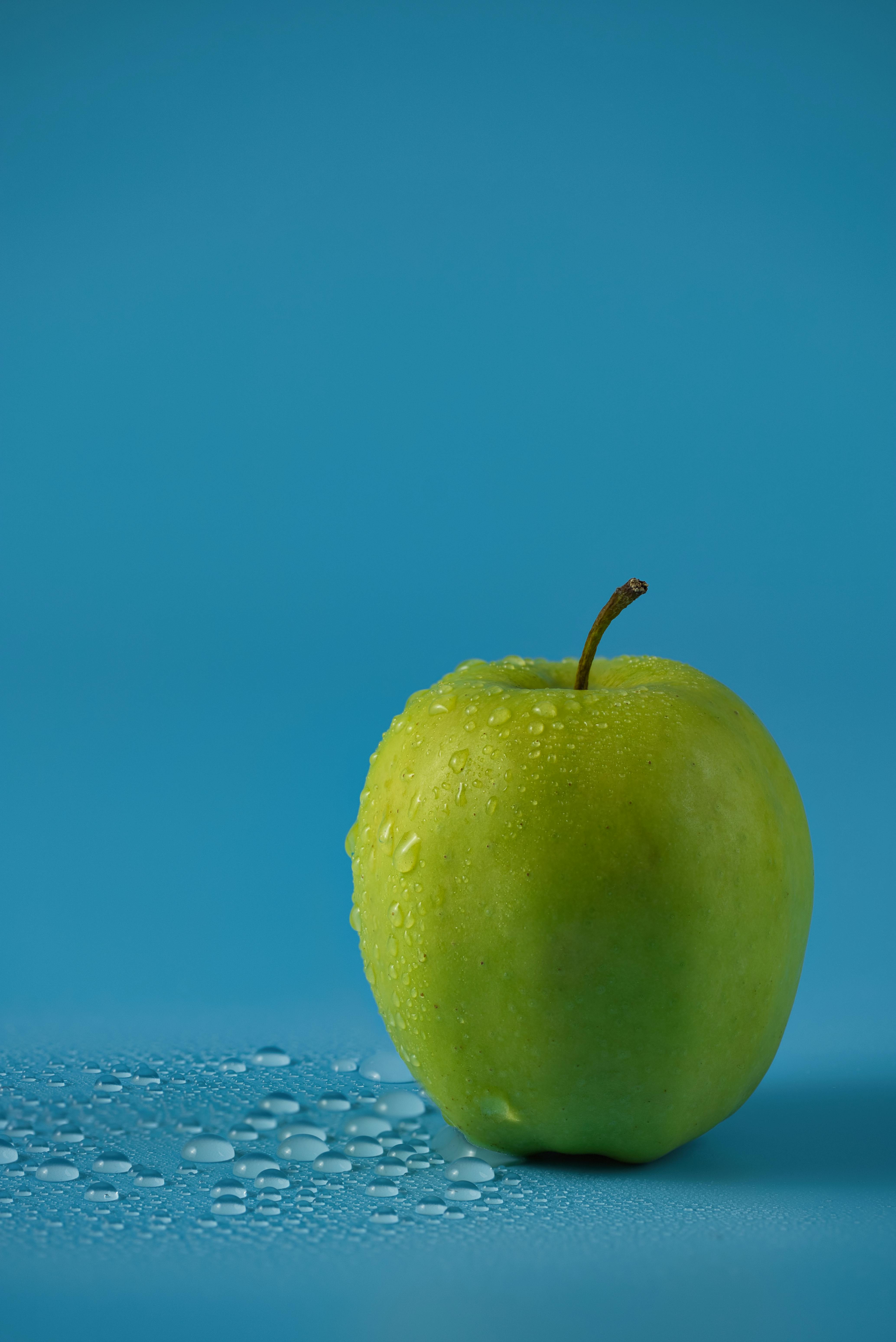 Apple on Blue Background · Free Stock Photo