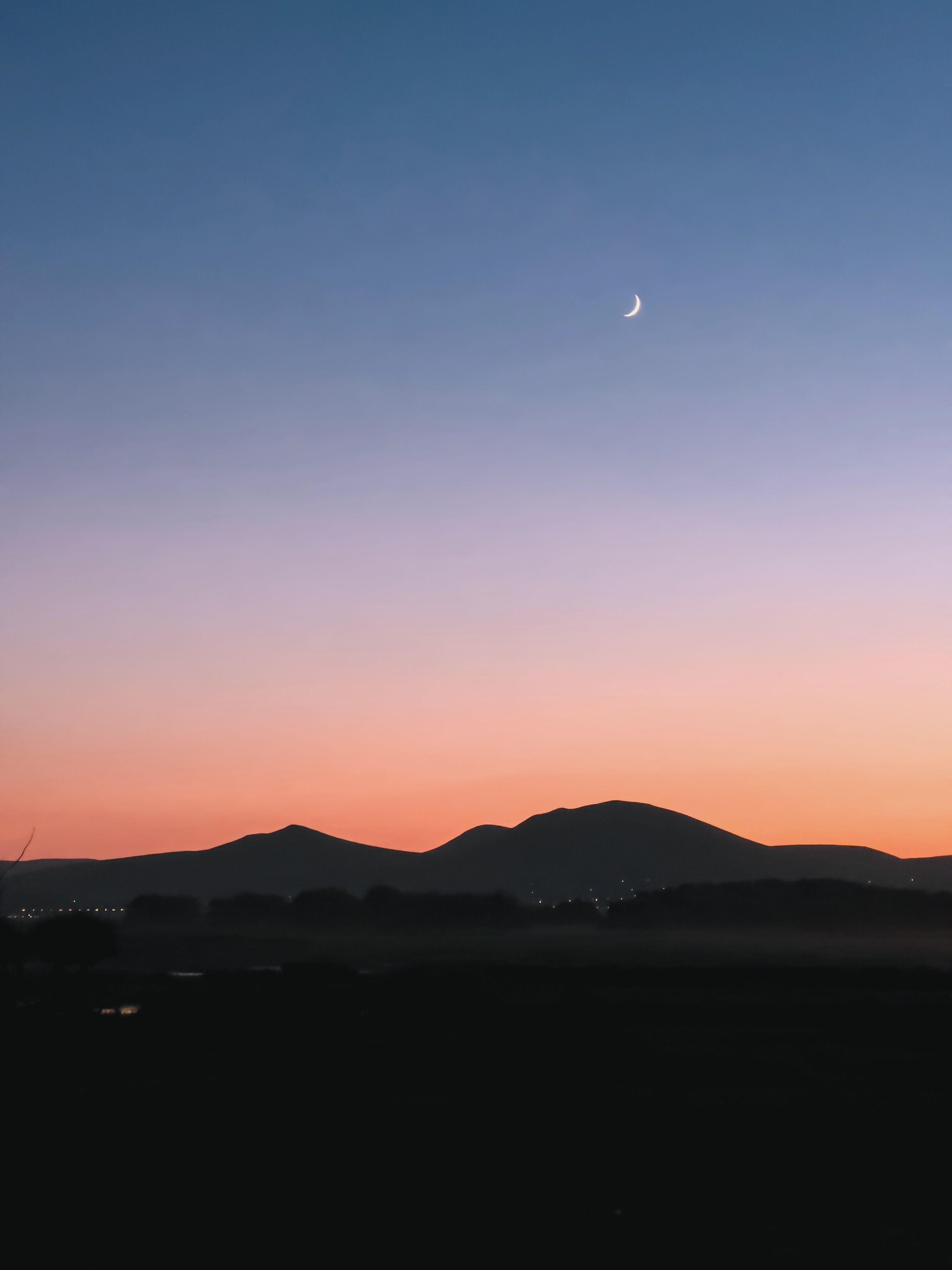 Crescent Moon in Sky over Hills · Free Stock Photo