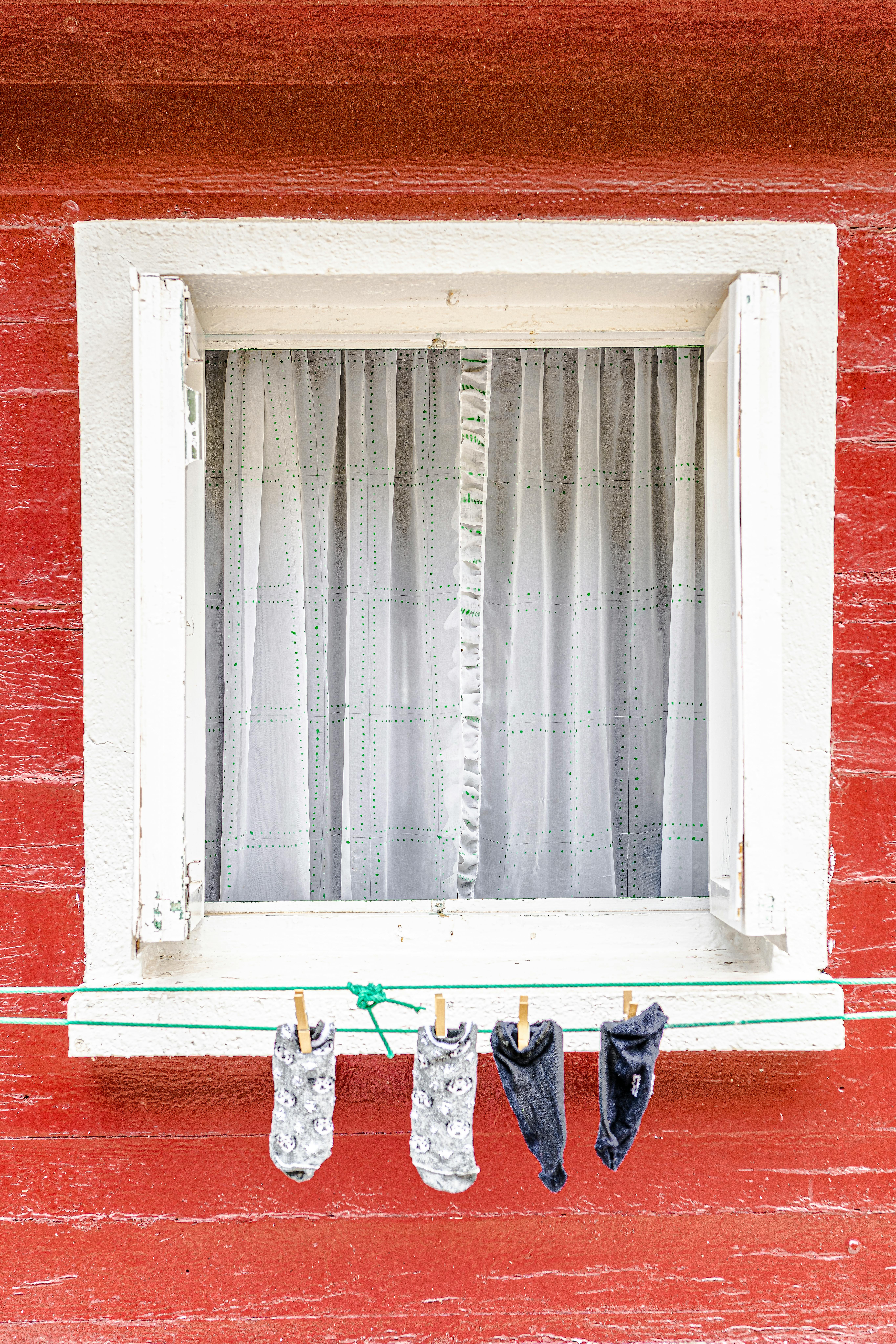 Socks Drying on Strings by Window · Free Stock Photo