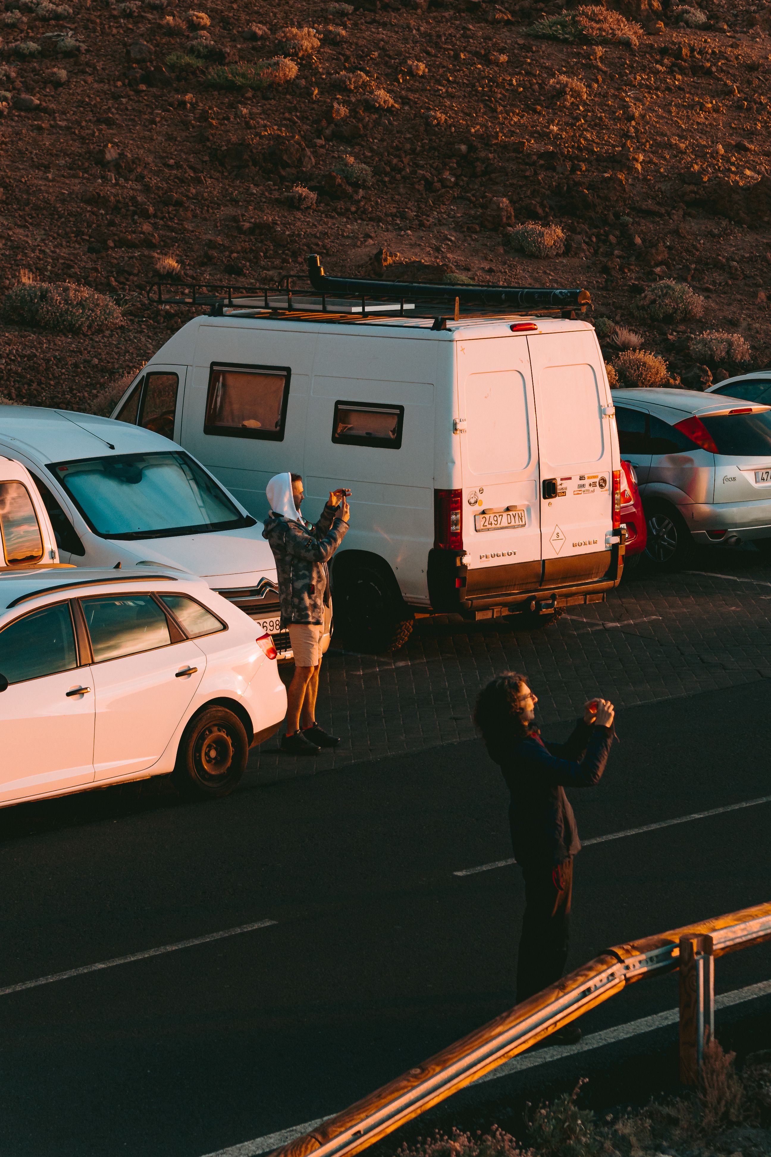 Tourists at a Roadside Parking Lot Taking Photos of the Setting Sun ...