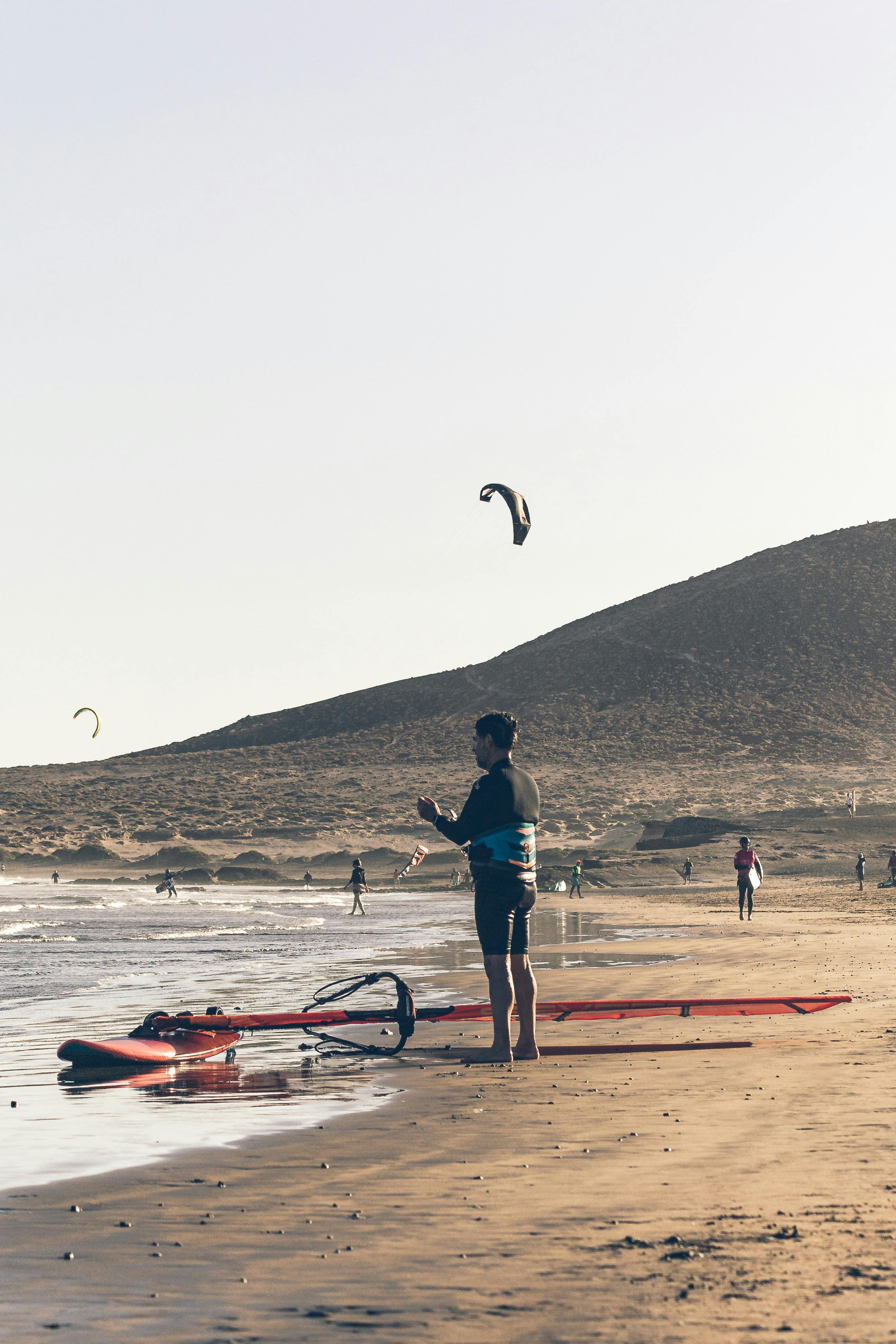 People with Kitesurfing Equipment on Beach · Free Stock Photo