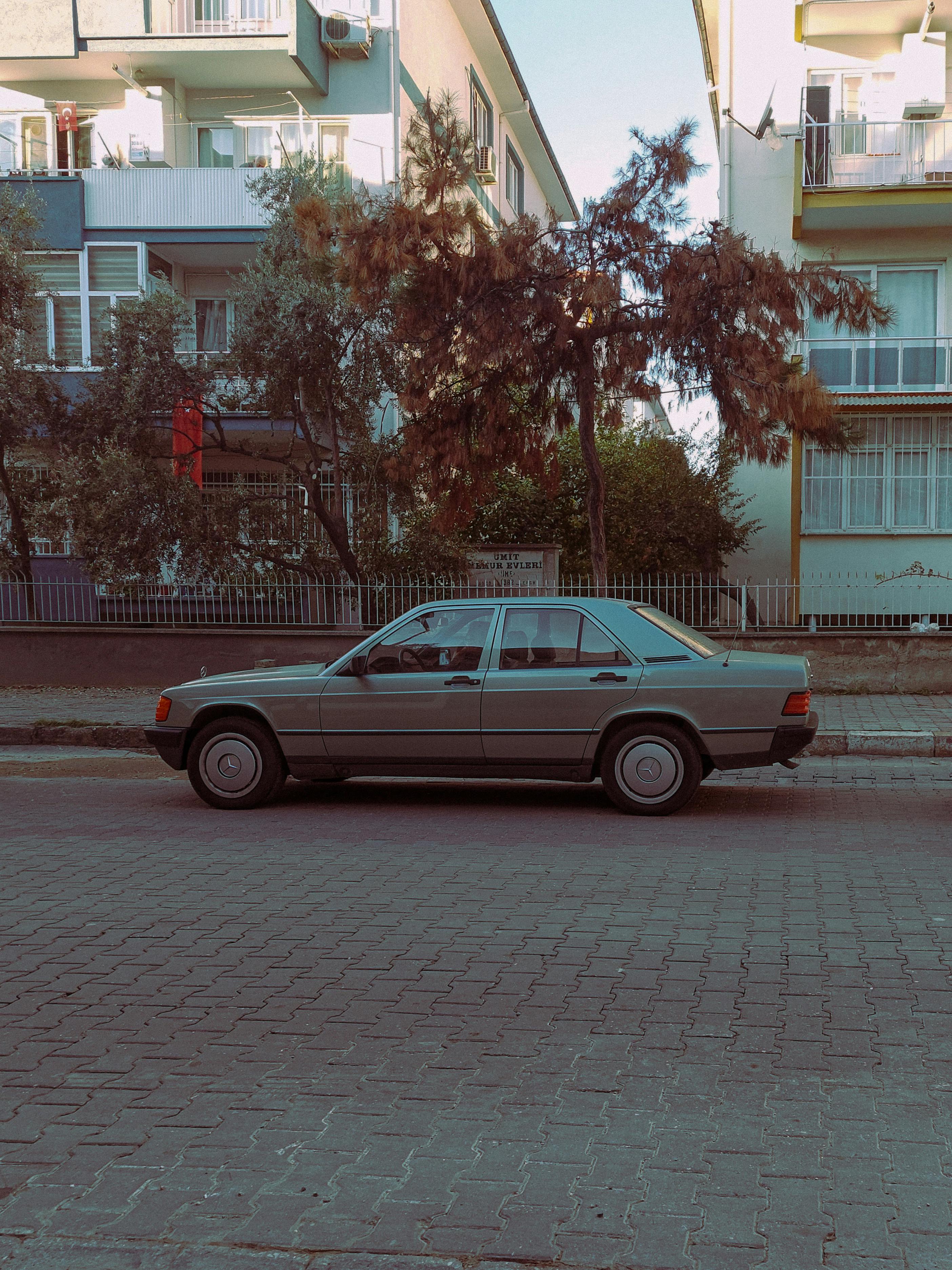 Side of Classic Mercedes-Benz W201 Parked on the Street · Free Stock Photo