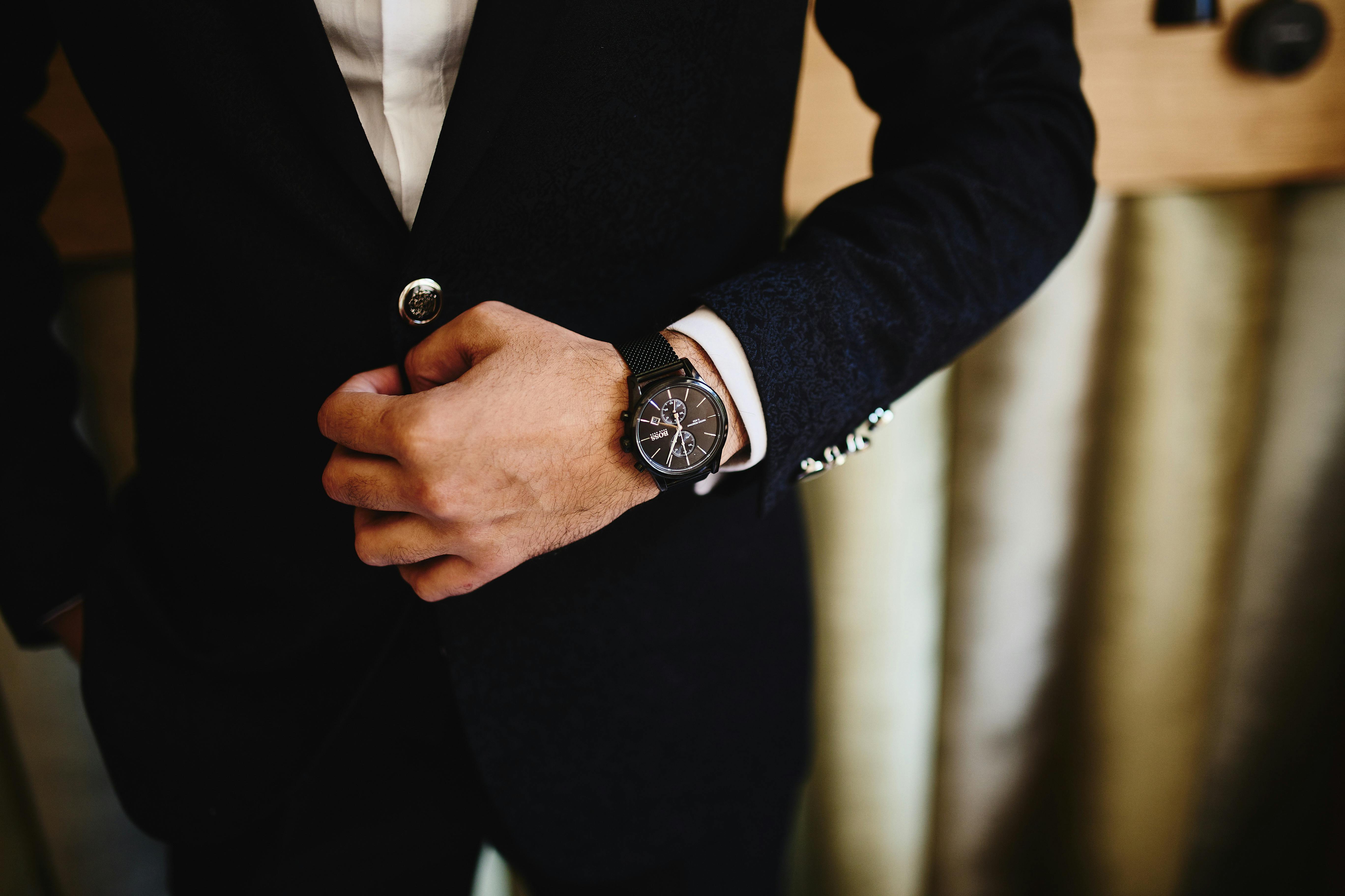 Black Watch on the Wrist of a Model in a Suit · Free Stock Photo