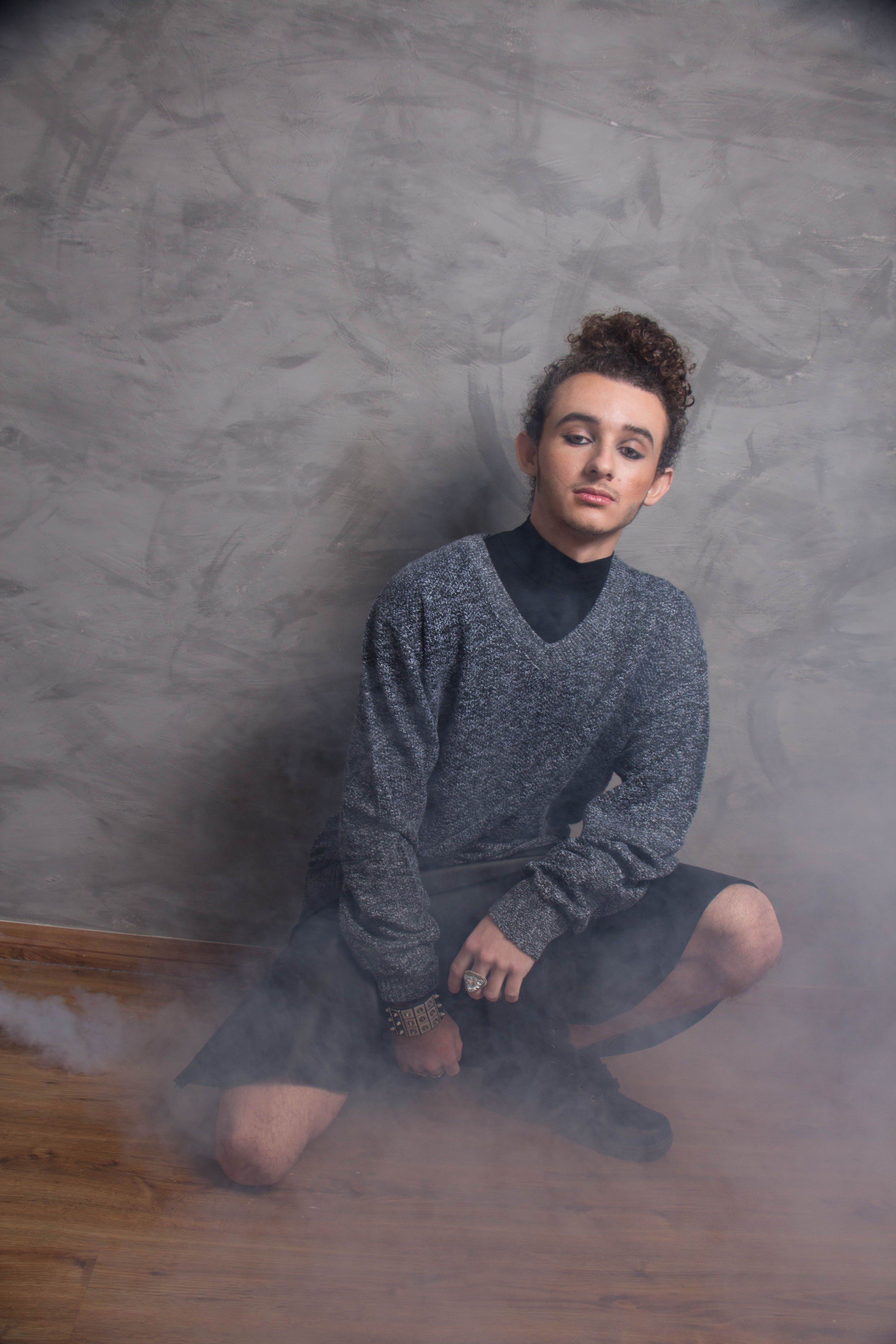 Male Model Posing in a Smoky Studio · Free Stock Photo