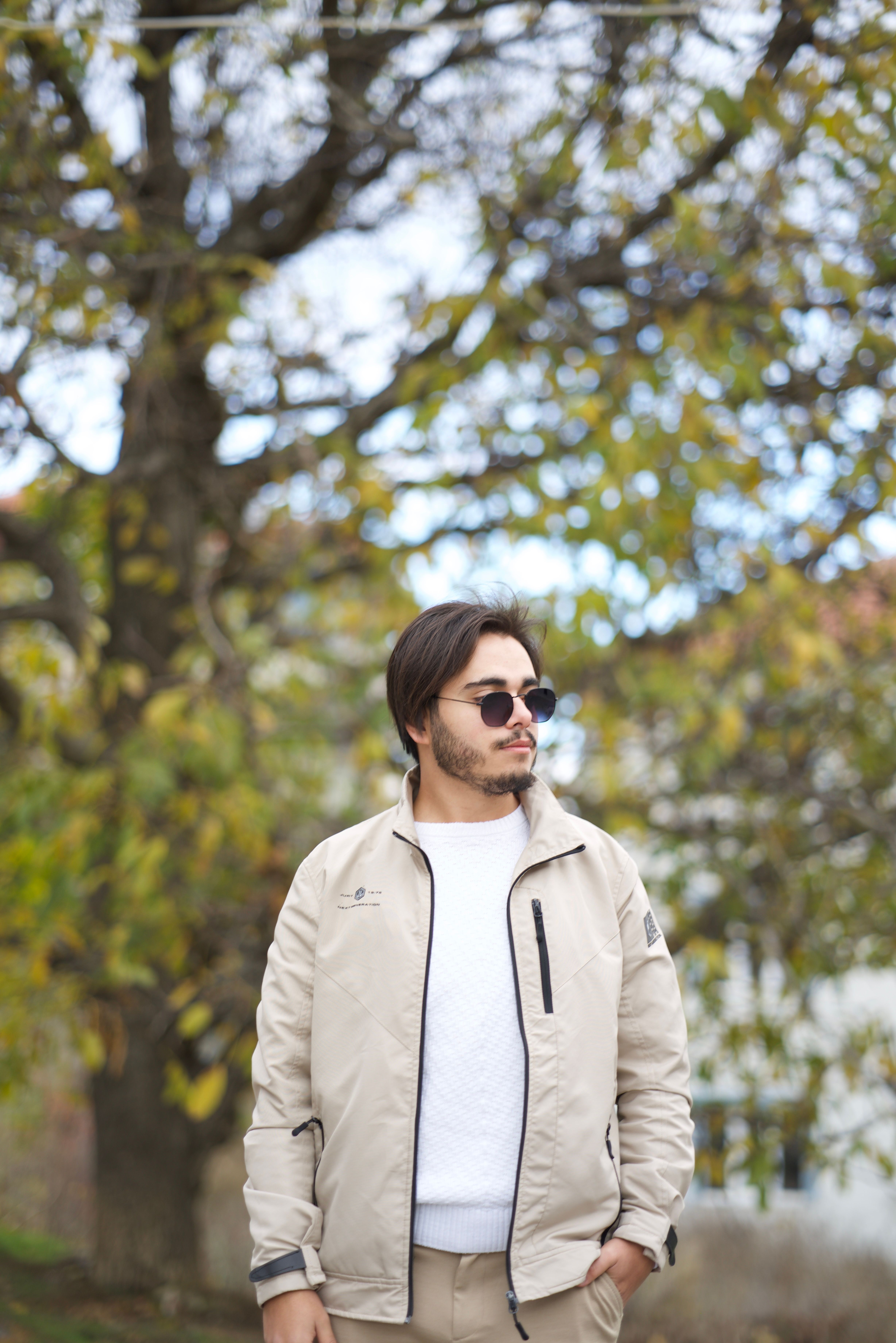 Man in Fall Coat Walking in Park · Free Stock Photo