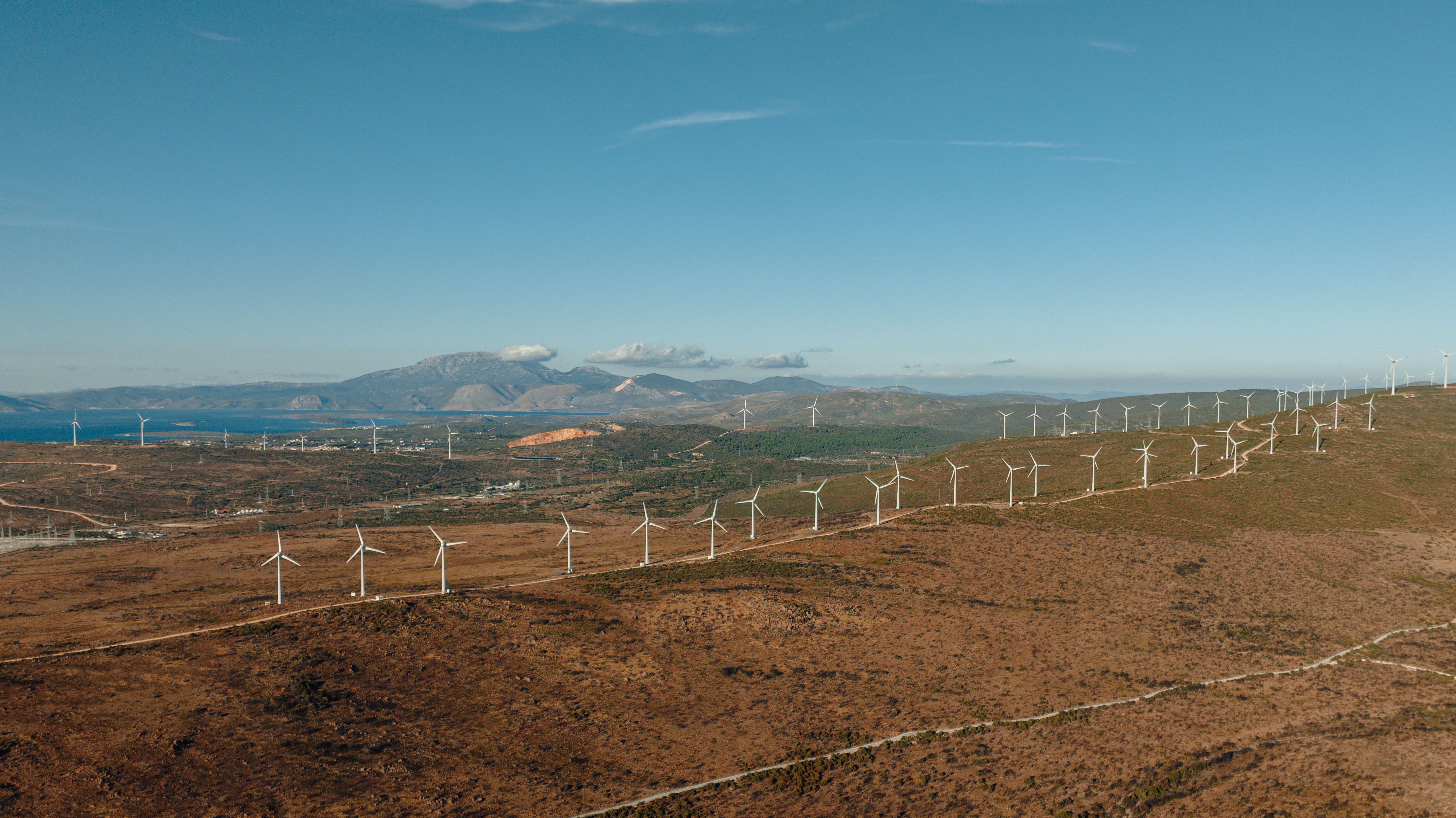 Wind Farm Turbines on the Hills Near the Sea · Free Stock Photo