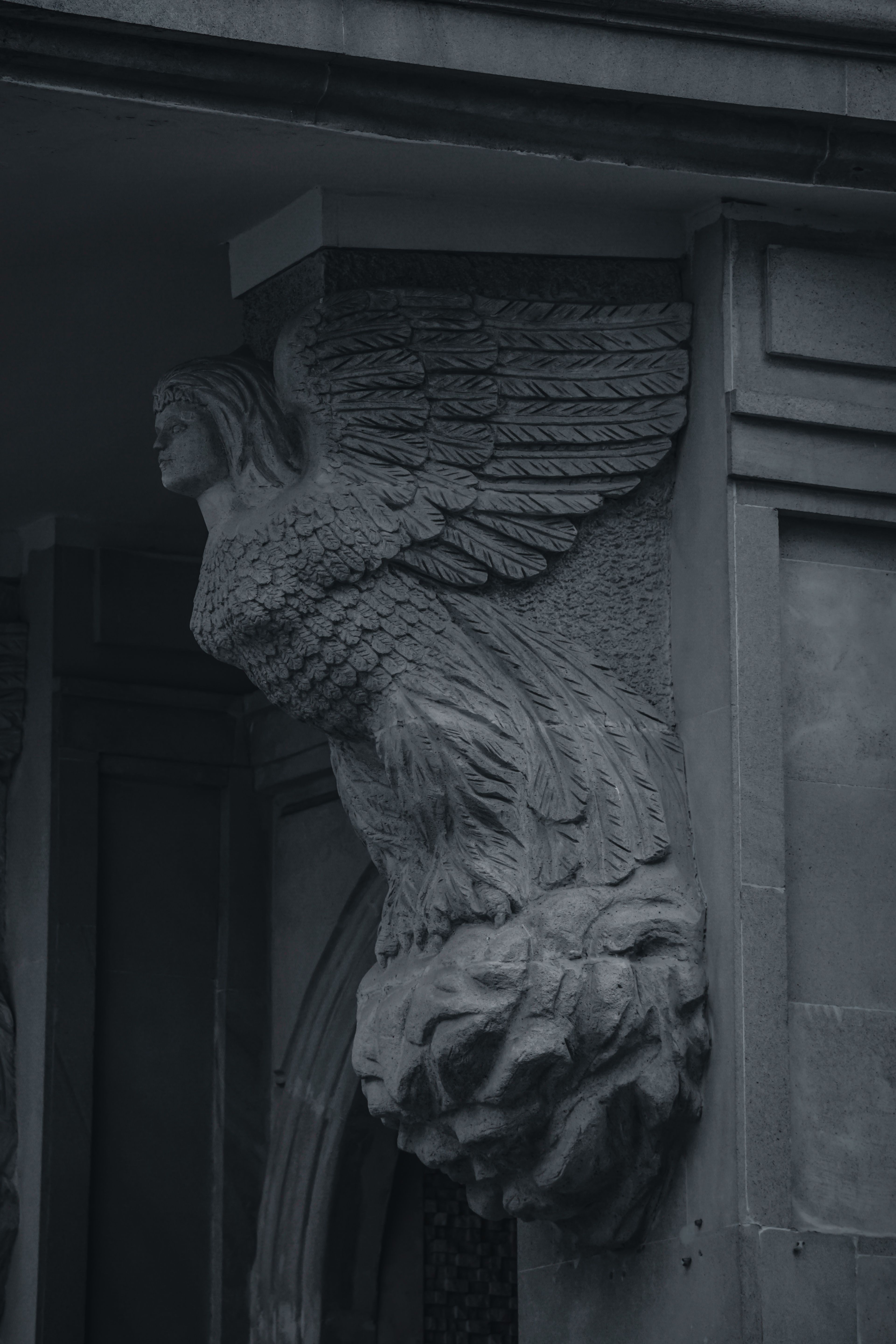 Relief of Woman atop Column Supporting Wall · Free Stock Photo