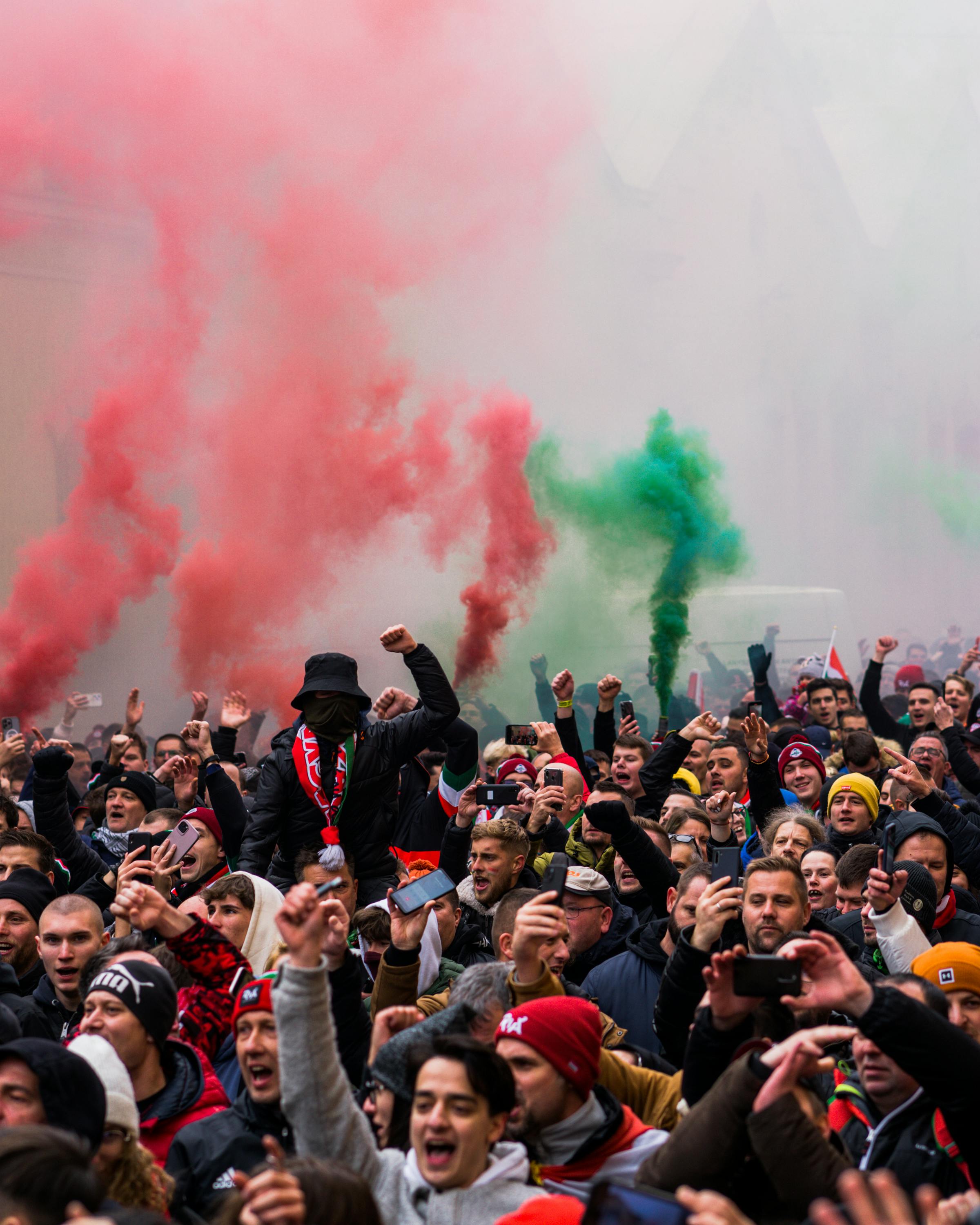 Crowd of Soccer Fans Celebrating with Smoke Flares · Free Stock Photo