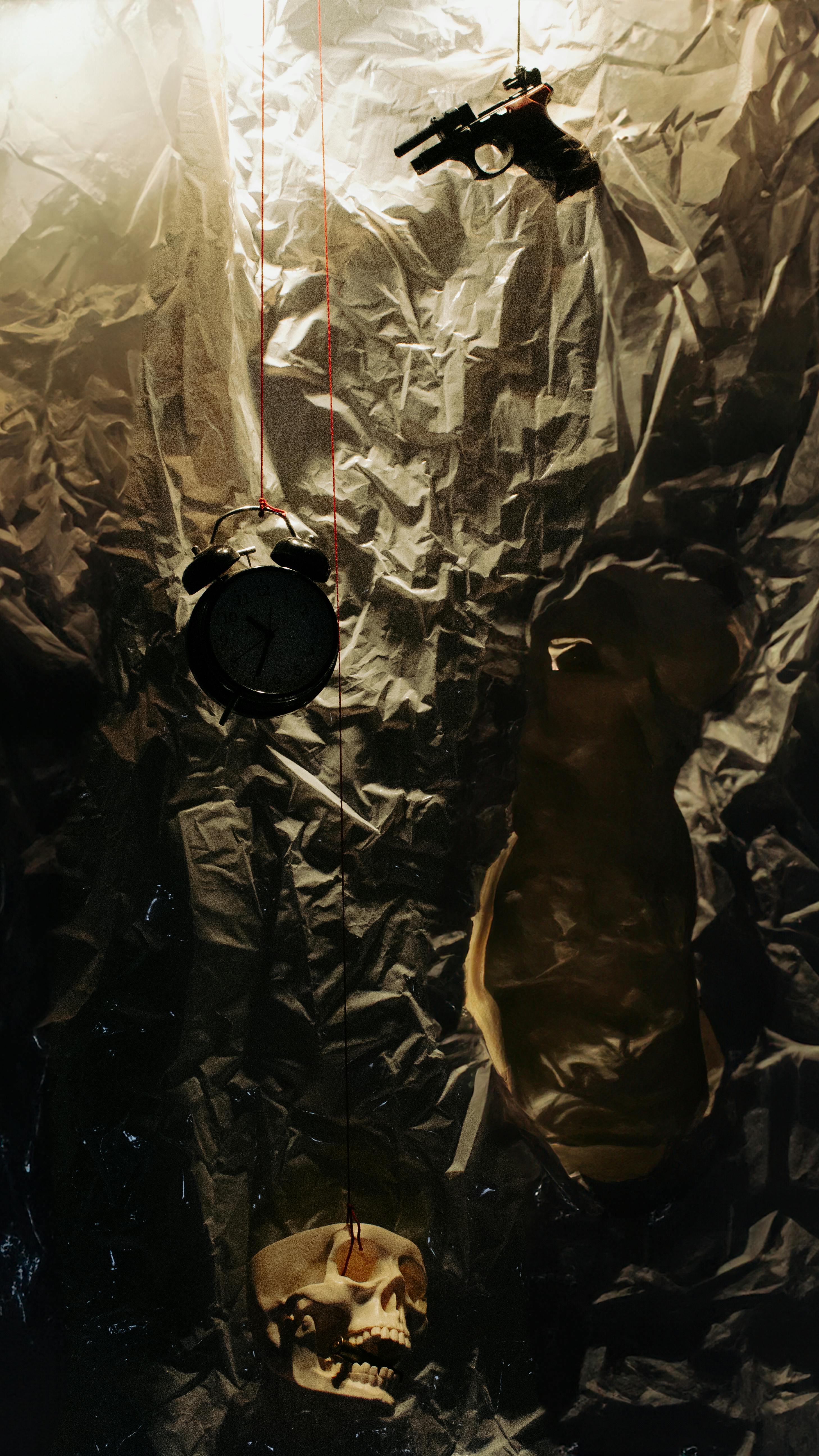 Various Items Hanging from Strings on Crinkled Paper Backgr · Free ...