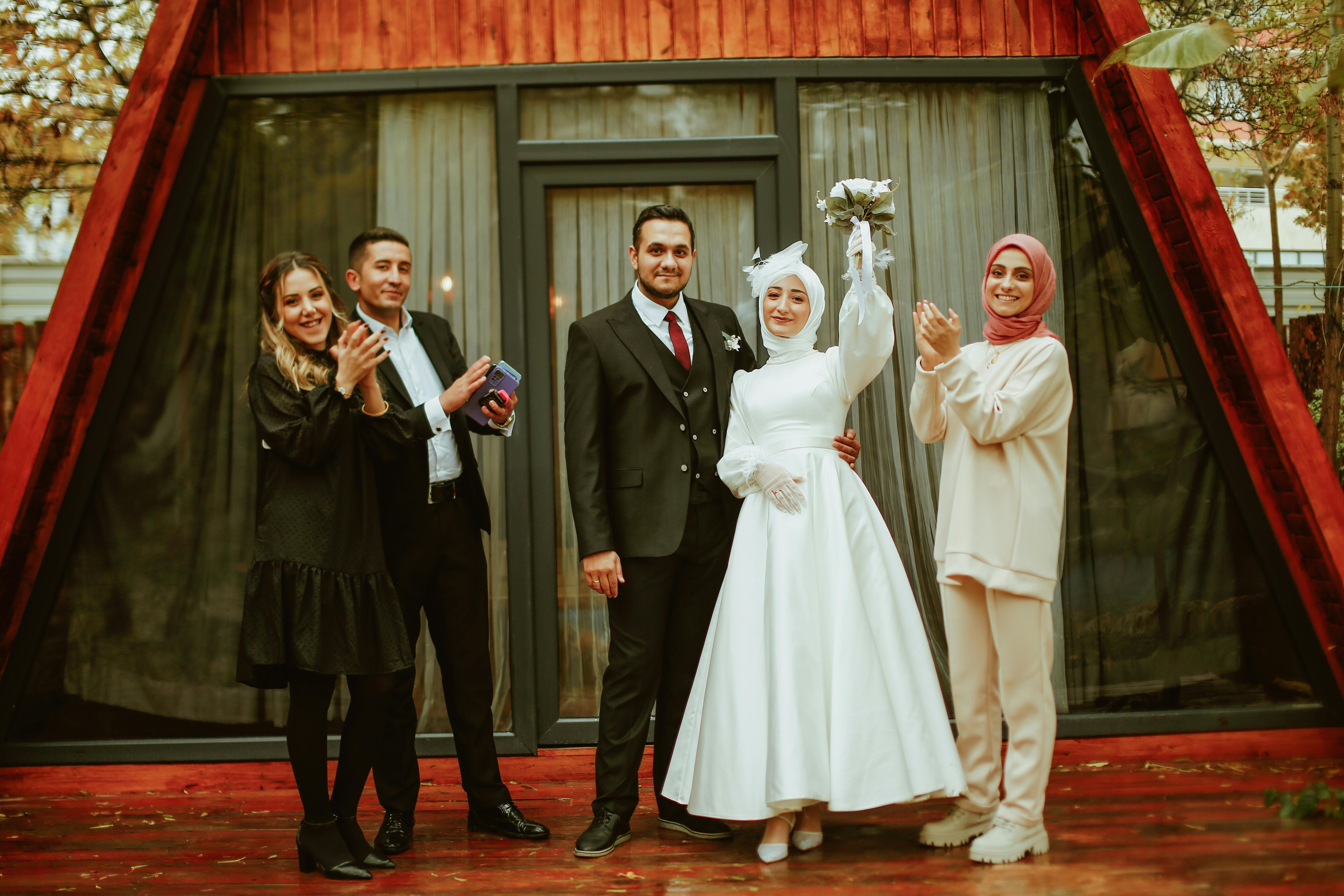 Guests Throwing Rice during a Wedding Ceremony · Free Stock Photo