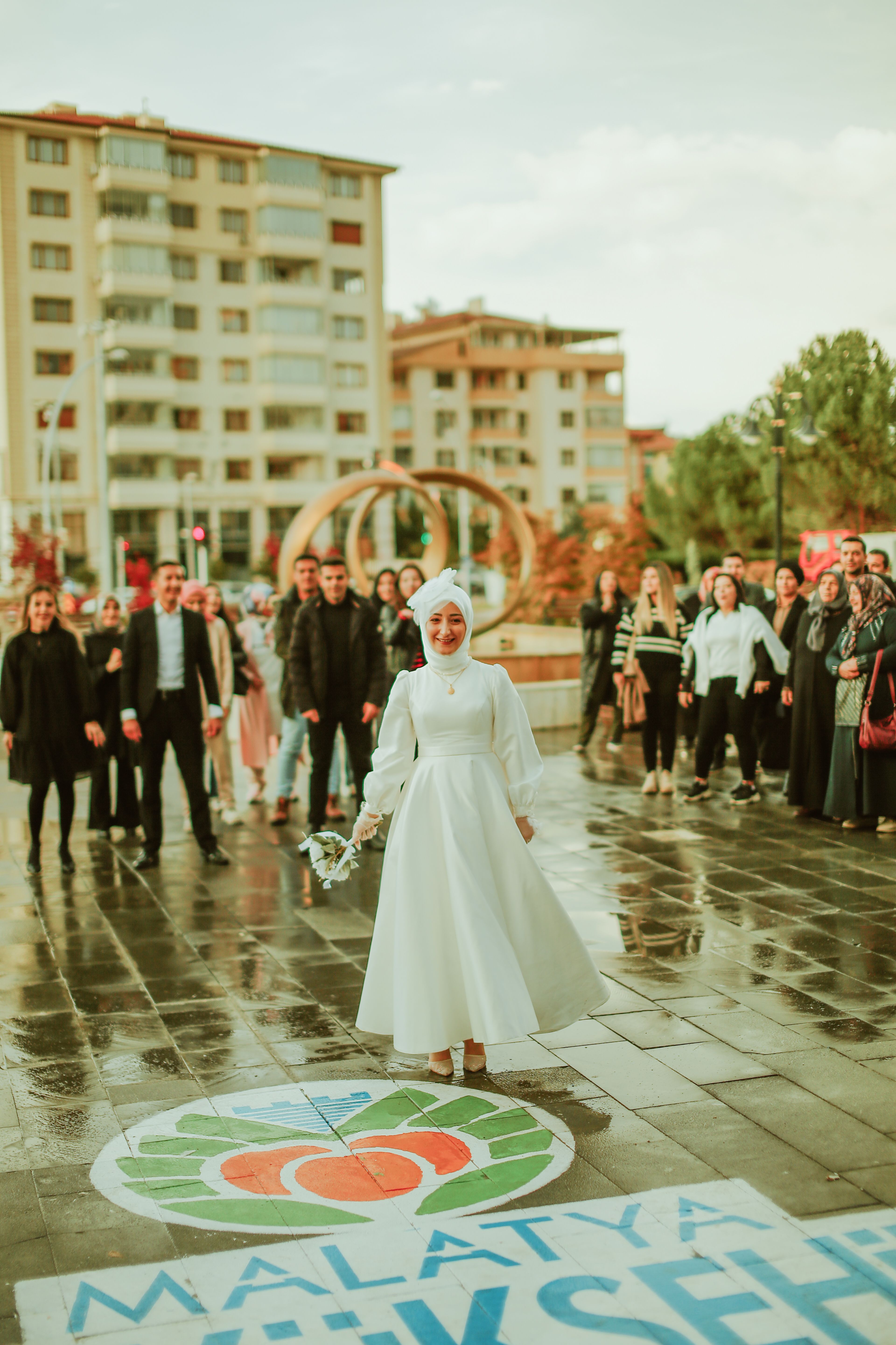 Bride Standing in the Center between the Wedding Guests Outside in City ...