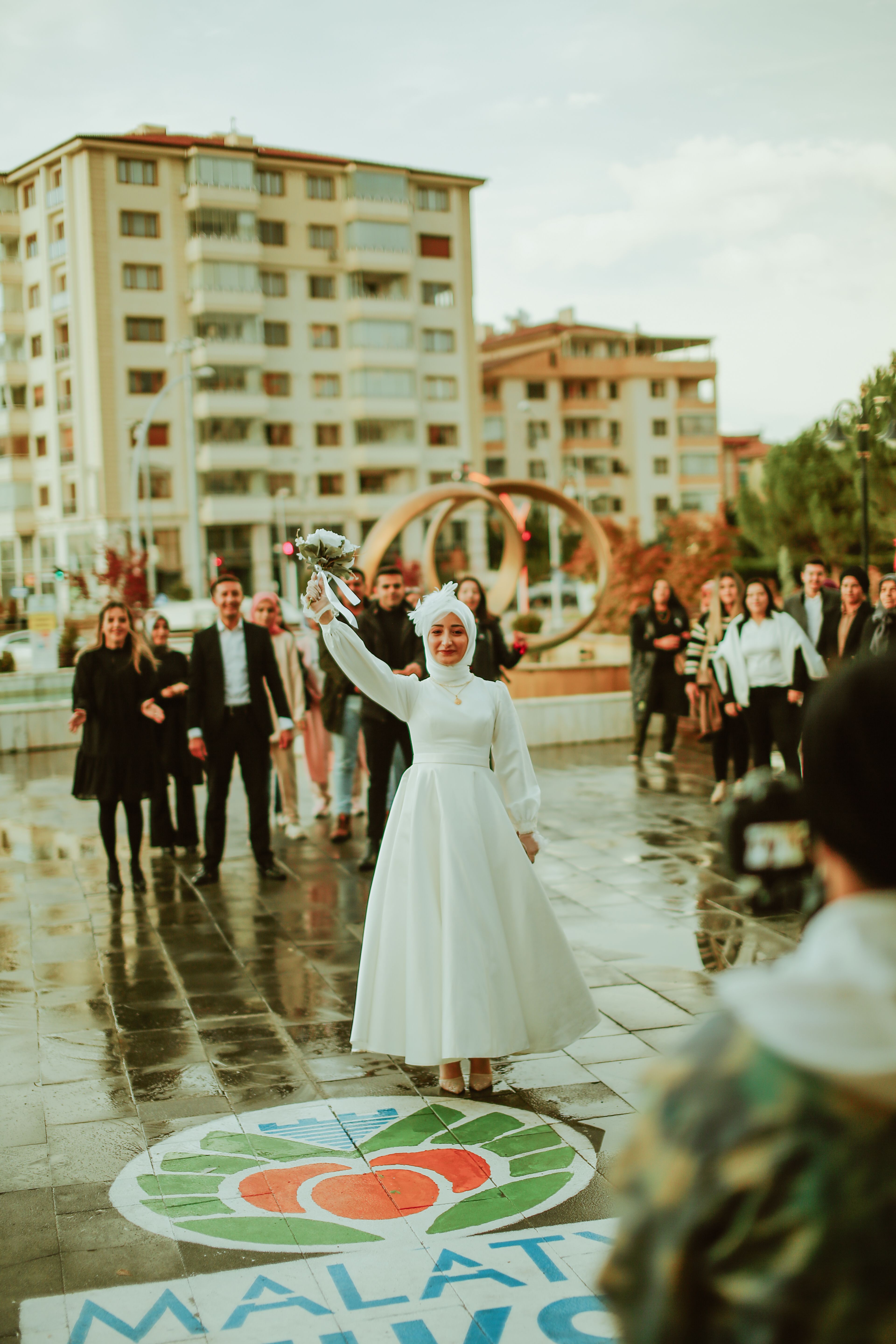 Bride Standing in the Center between the Wedding Guests Outside in City ...