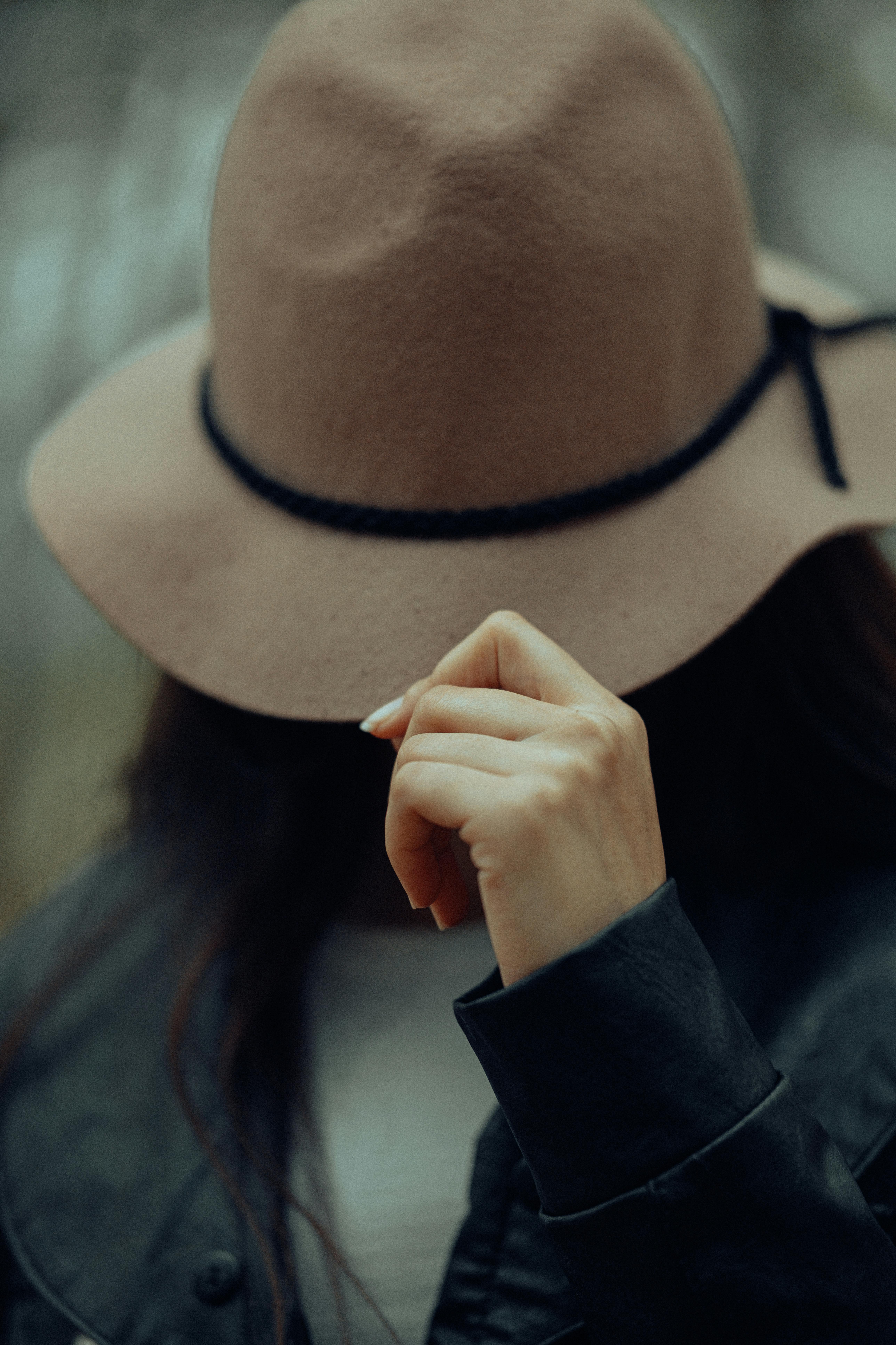 Woman Hand Holding Hat · Free Stock Photo