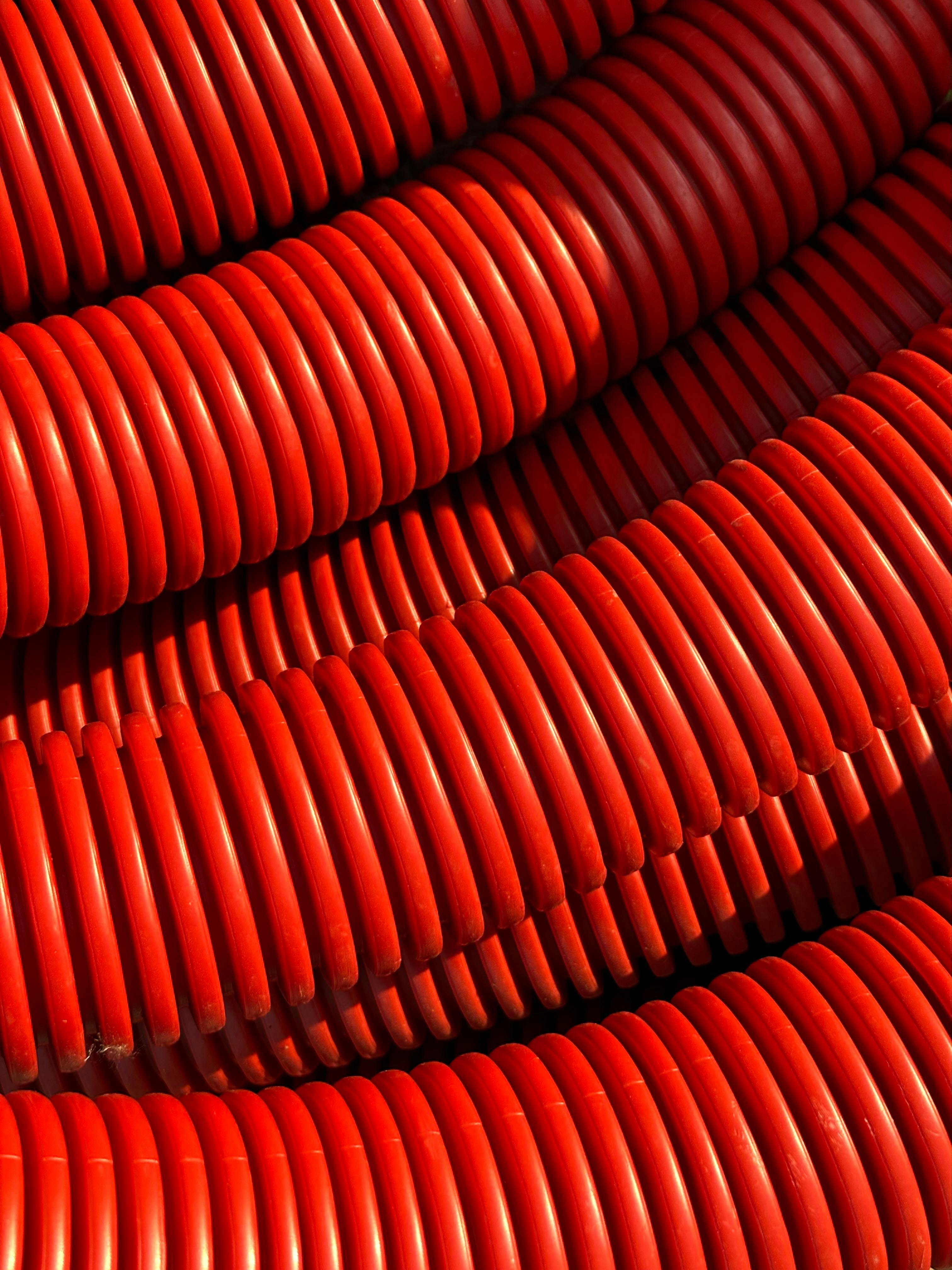 Red Pipes in Sunlight · Free Stock Photo