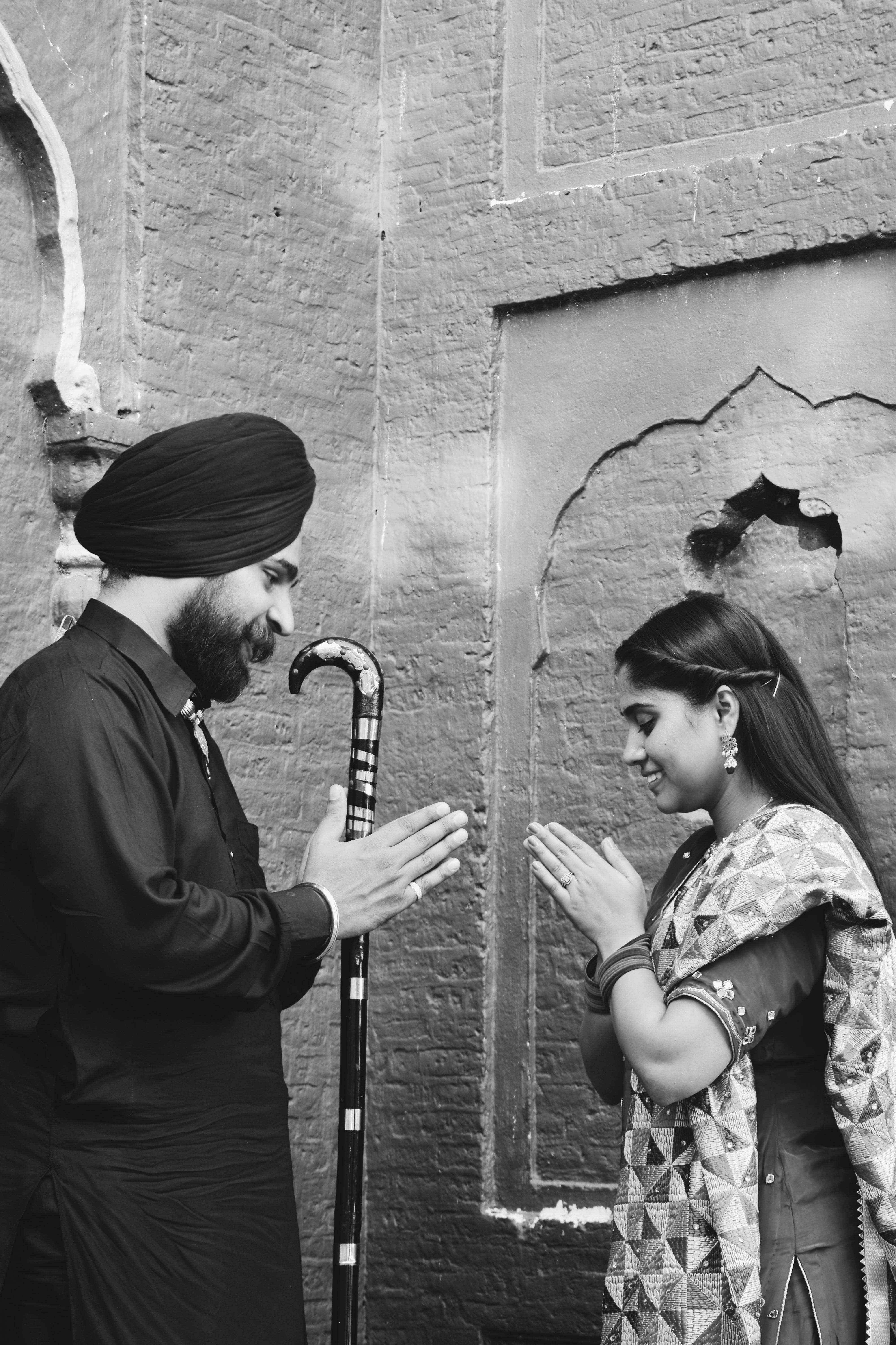 Bearded Man and Smiling Woman Greeting Each Other · Free Stock Photo