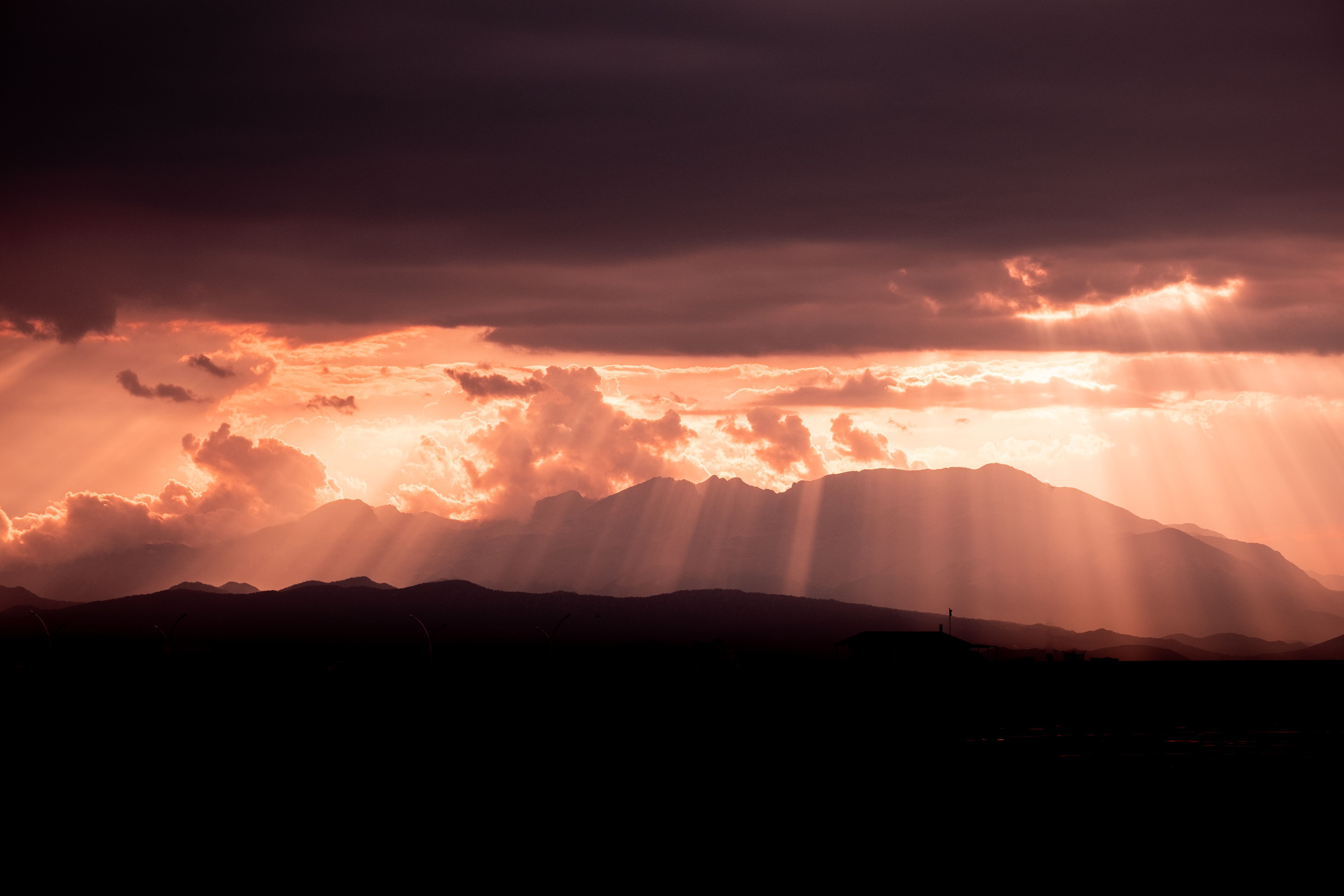 Sun Beams Shining Through Clouds at Dawn · Free Stock Photo
