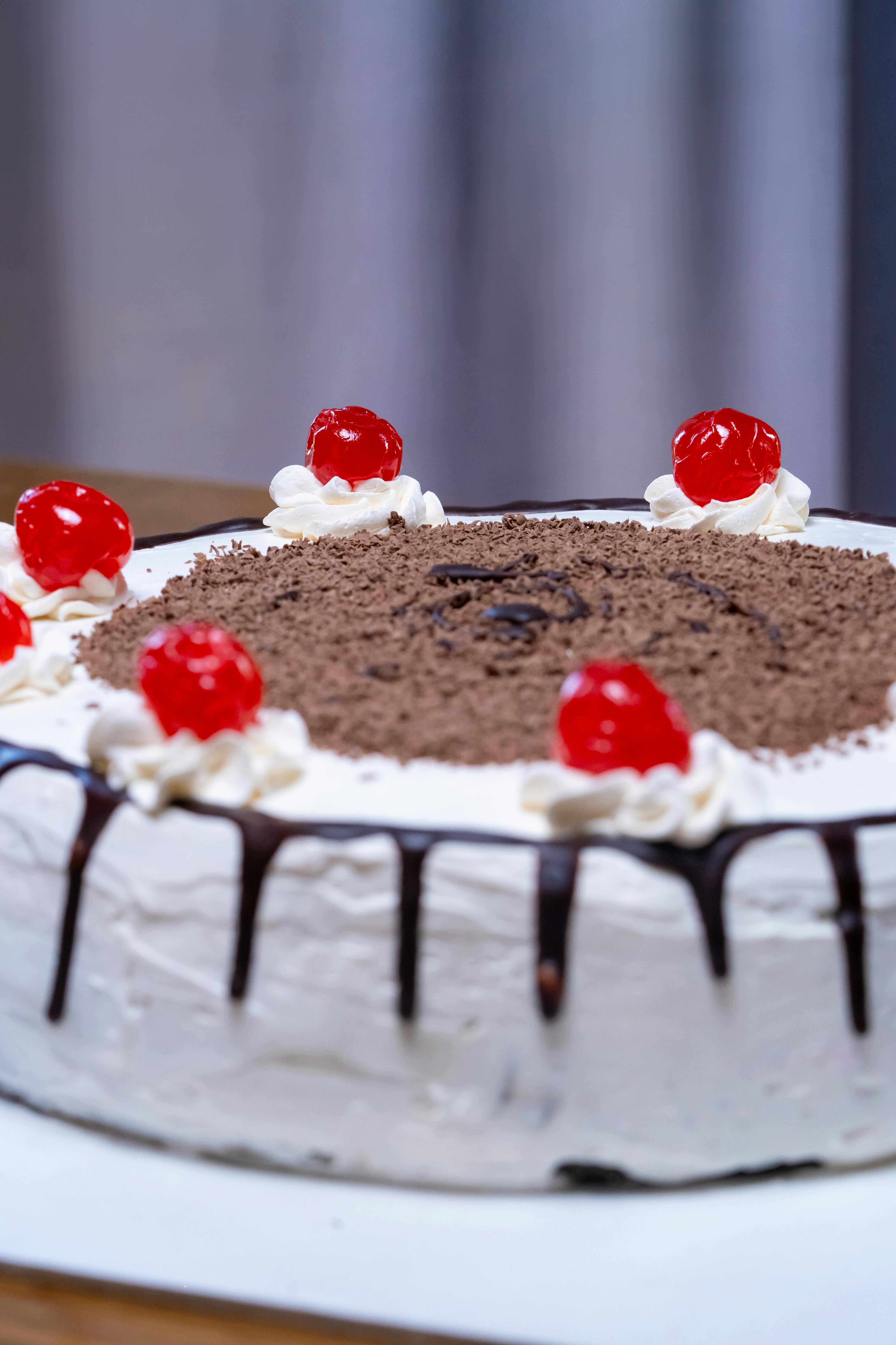 Close-up of a Layer Cake With Cream and Cherries · Free Stock Photo