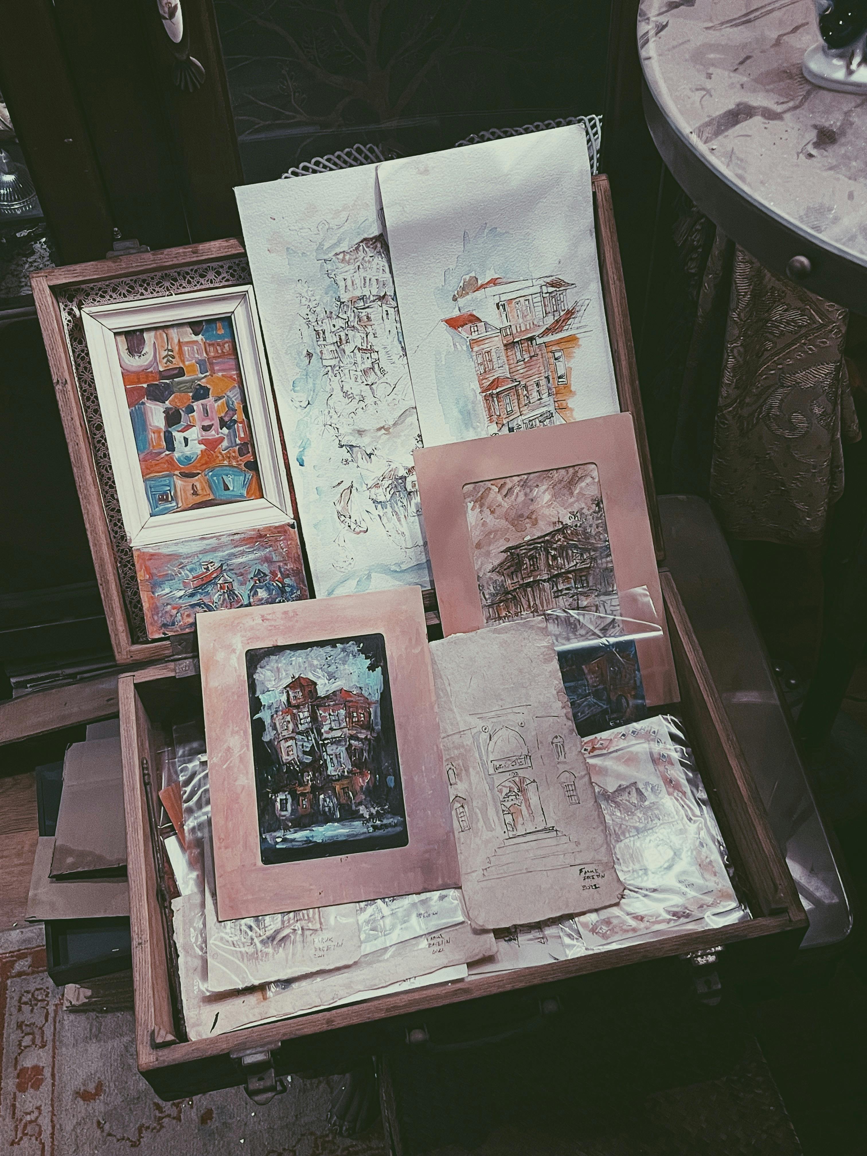 Paintings in an Old Suitcase · Free Stock Photo