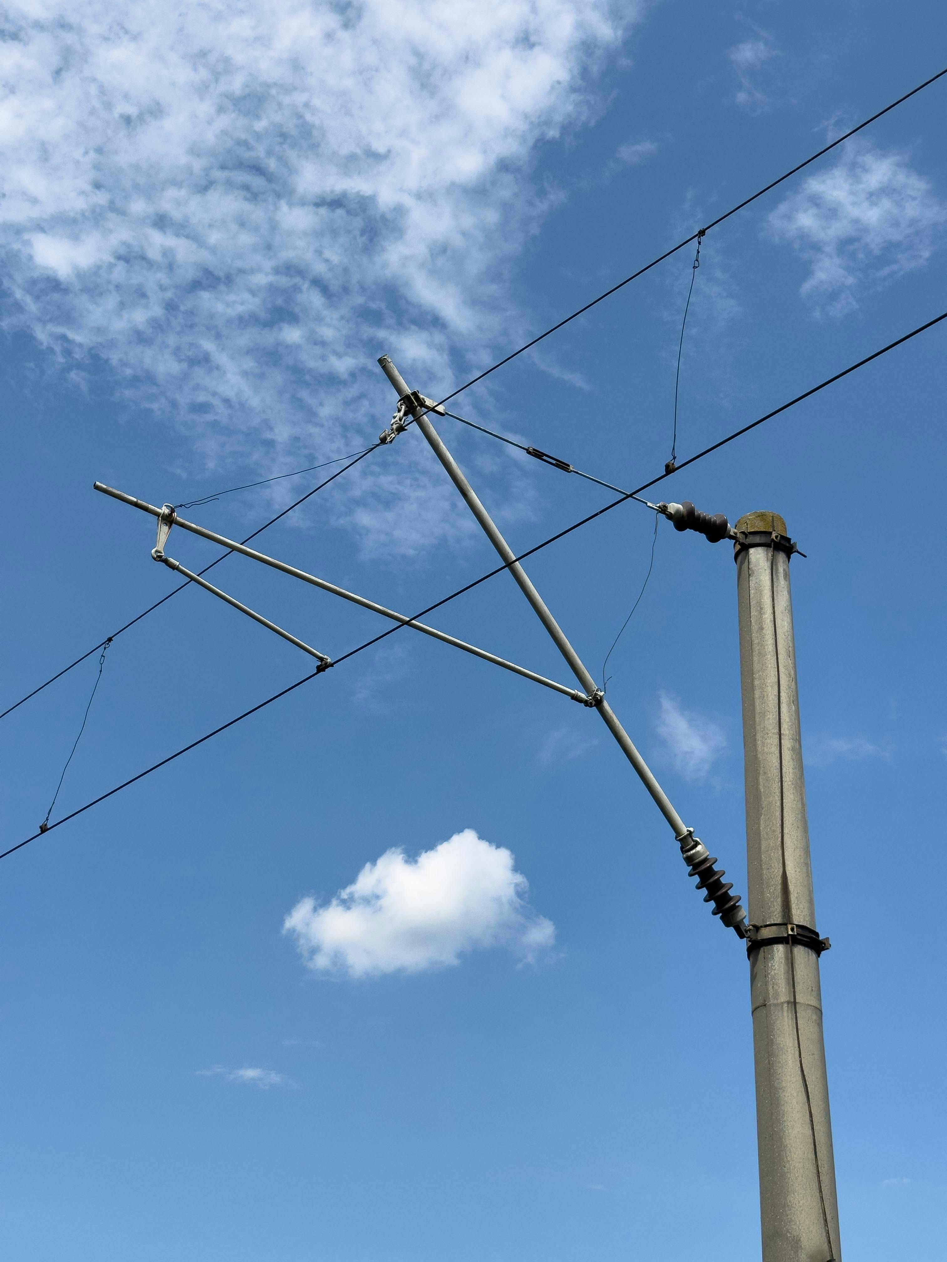 Railway Overhead Lines on a Transmission Pole · Free Stock Photo