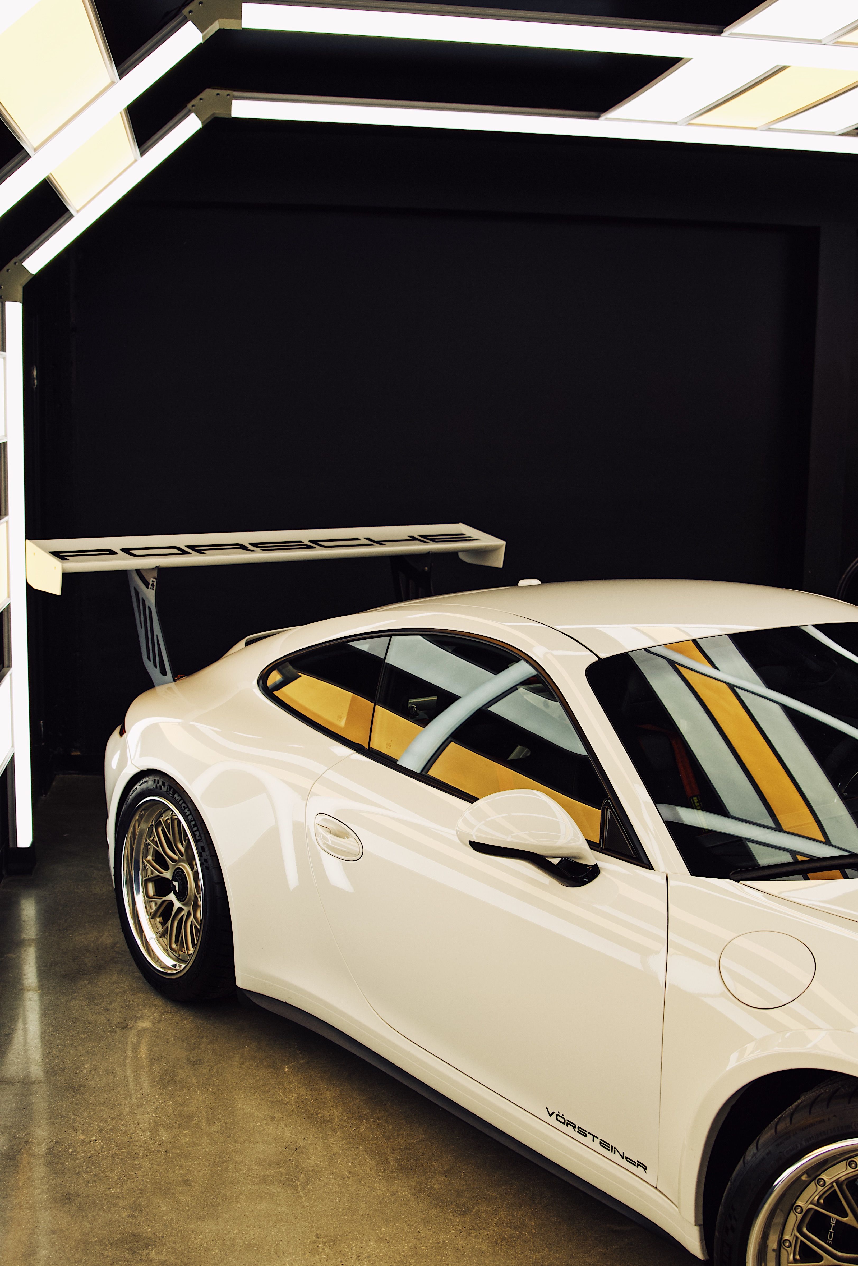 White Luxury Car in a Car Showroom · Free Stock Photo