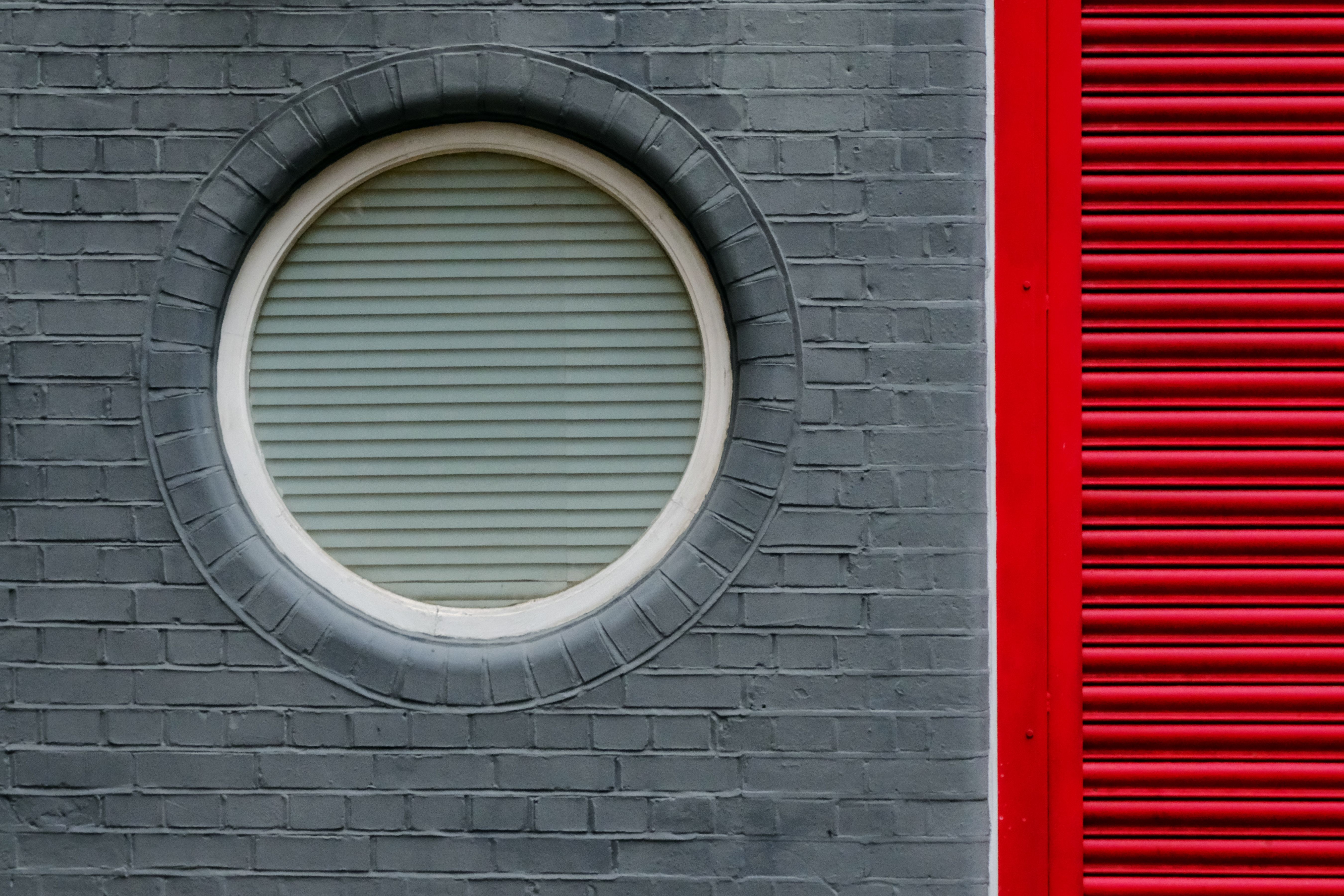 Circular Window on Wall · Free Stock Photo