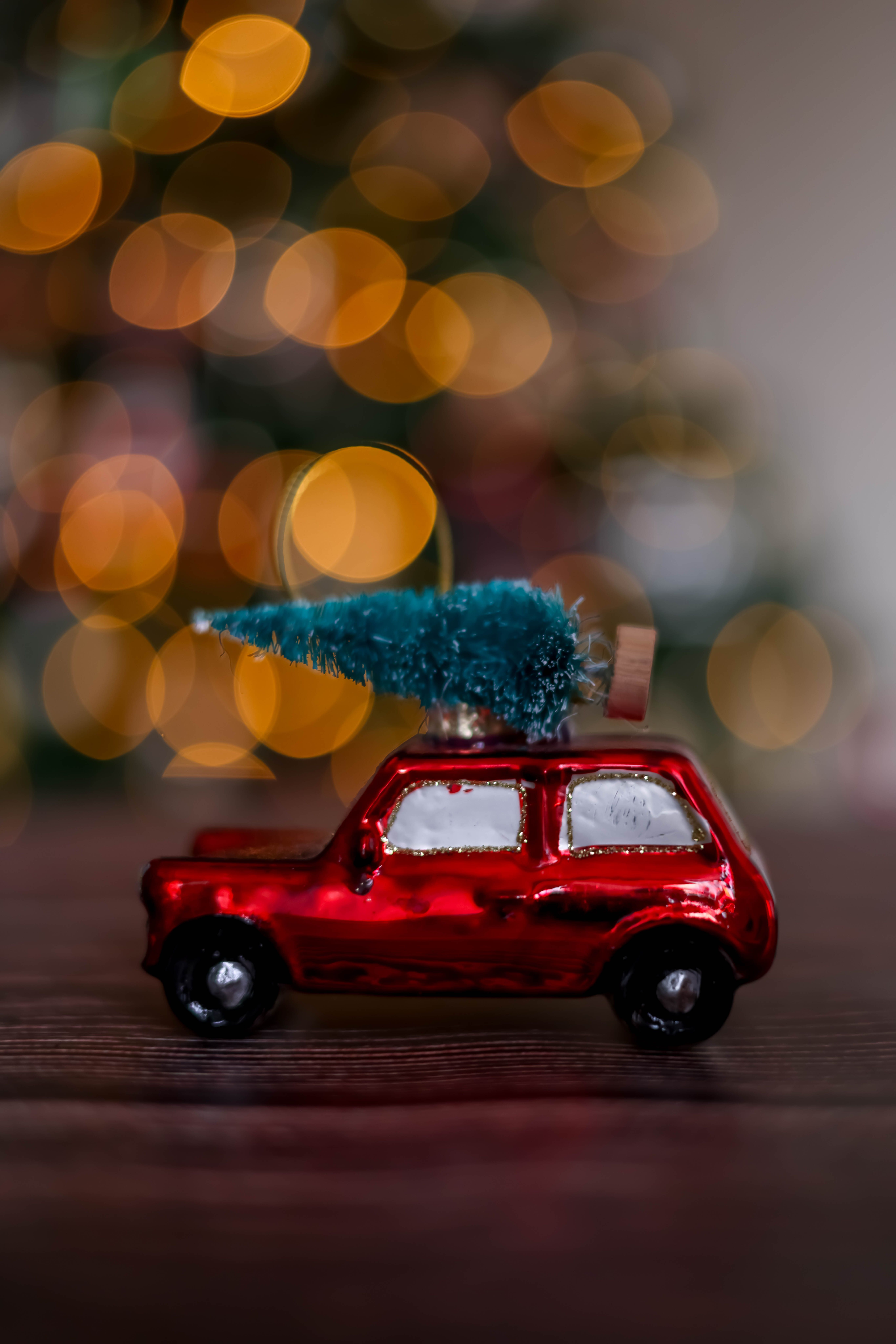 Photo of Miniature Red Car and Pine Tree · Free Stock Photo