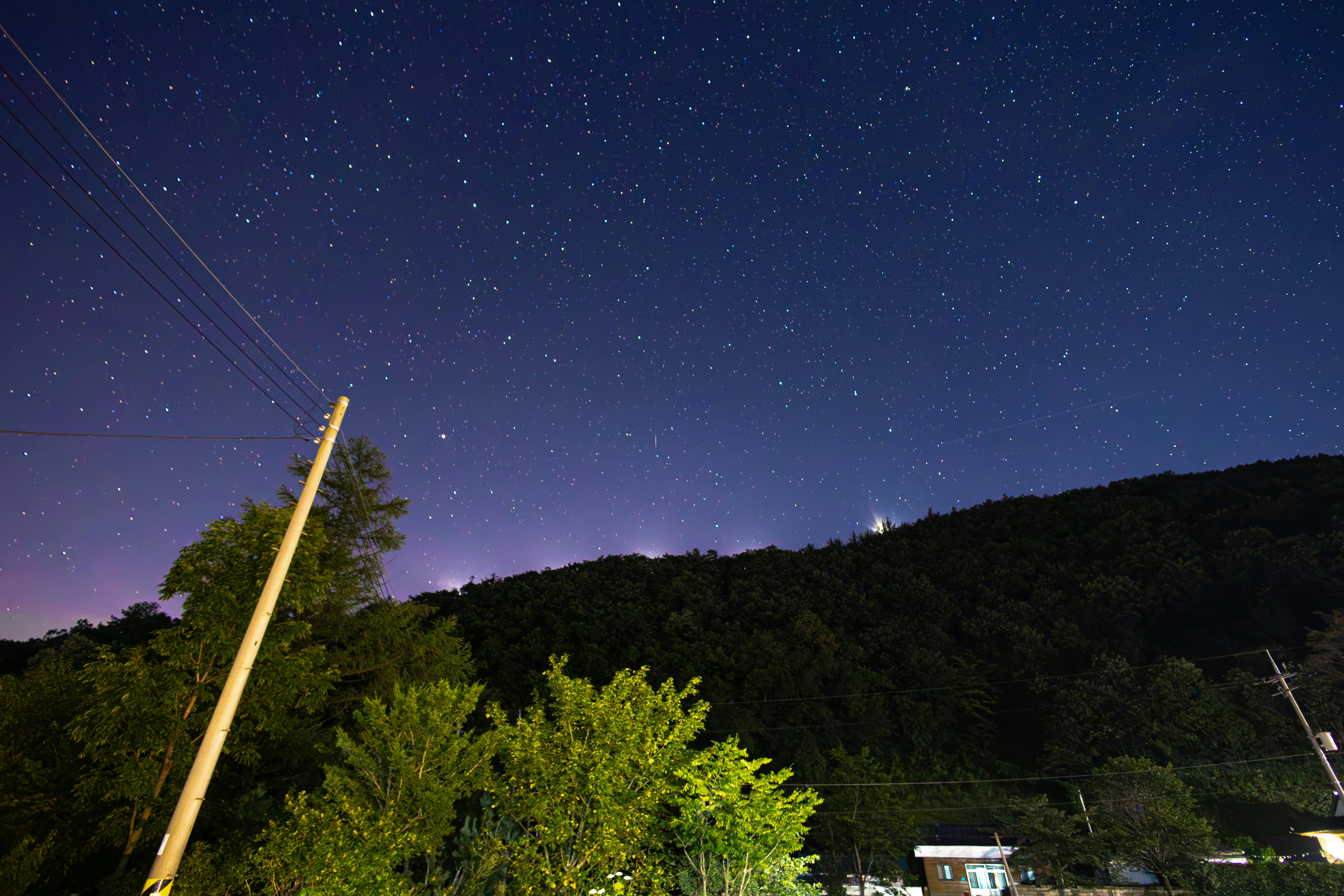 Small Village at Night on Forested Mountain · Free Stock Photo