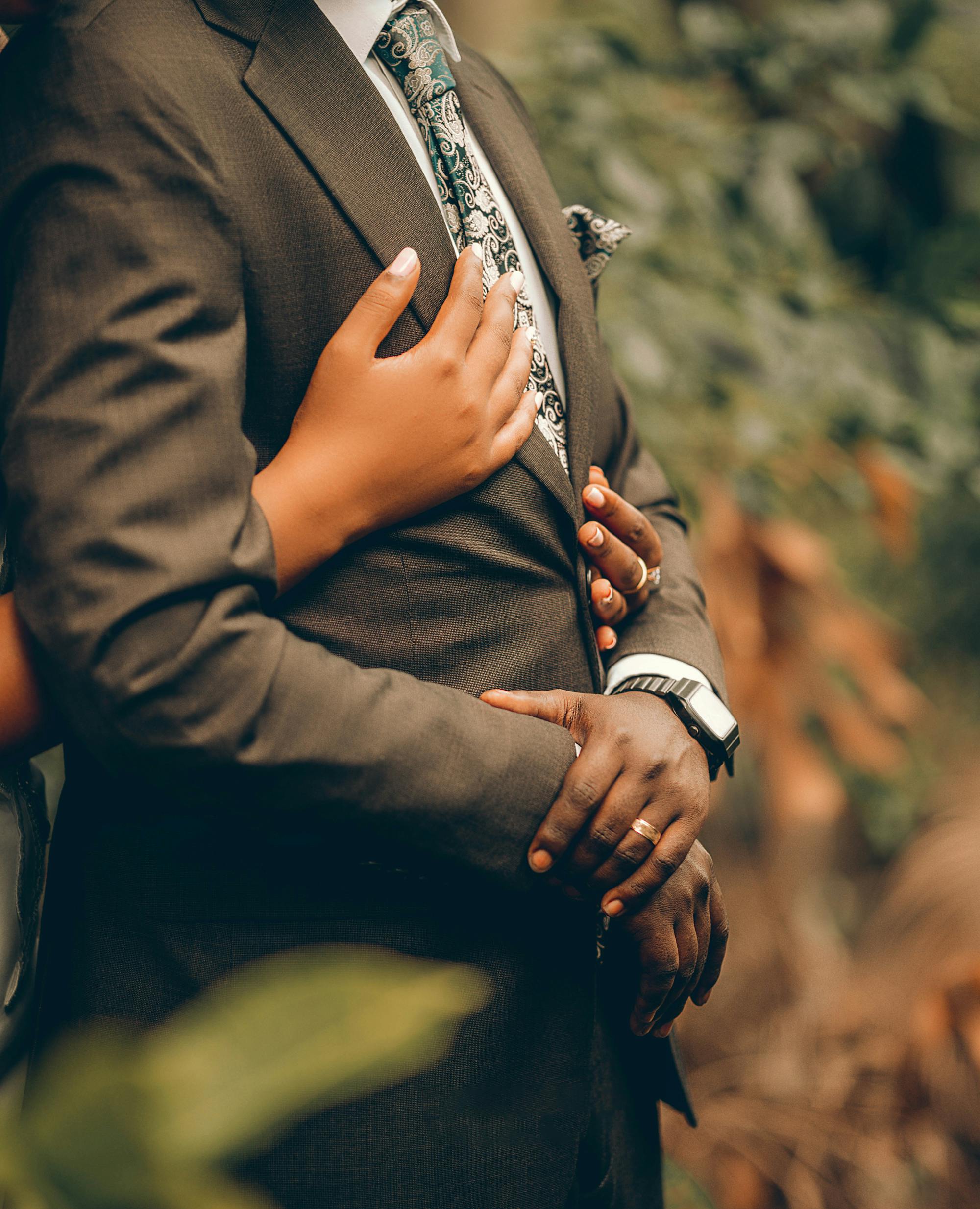 Woman Hands Hugging Man in Suit · Free Stock Photo