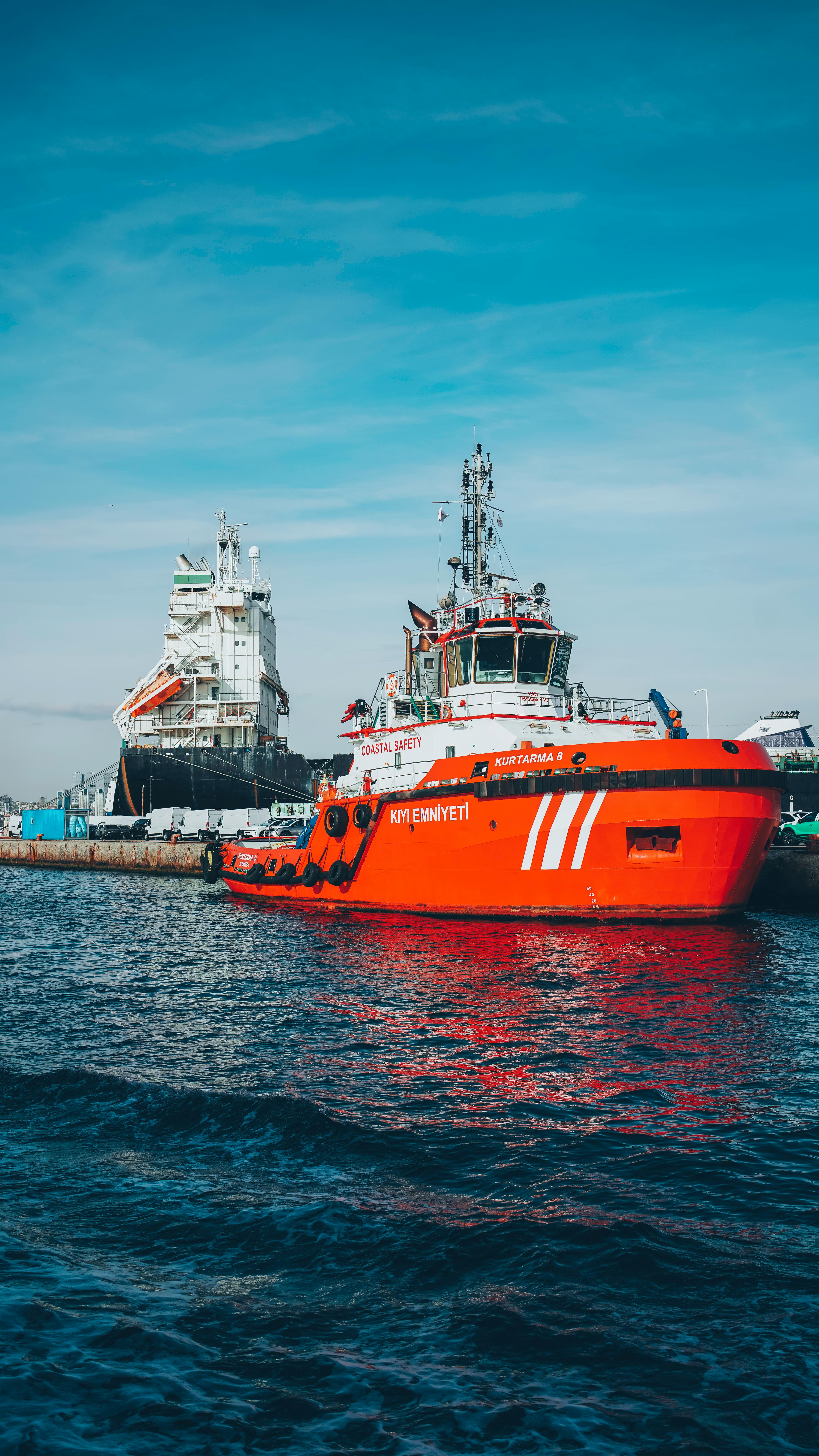 A Cargo Ship and a Tug Boat near the Port · Free Stock Photo