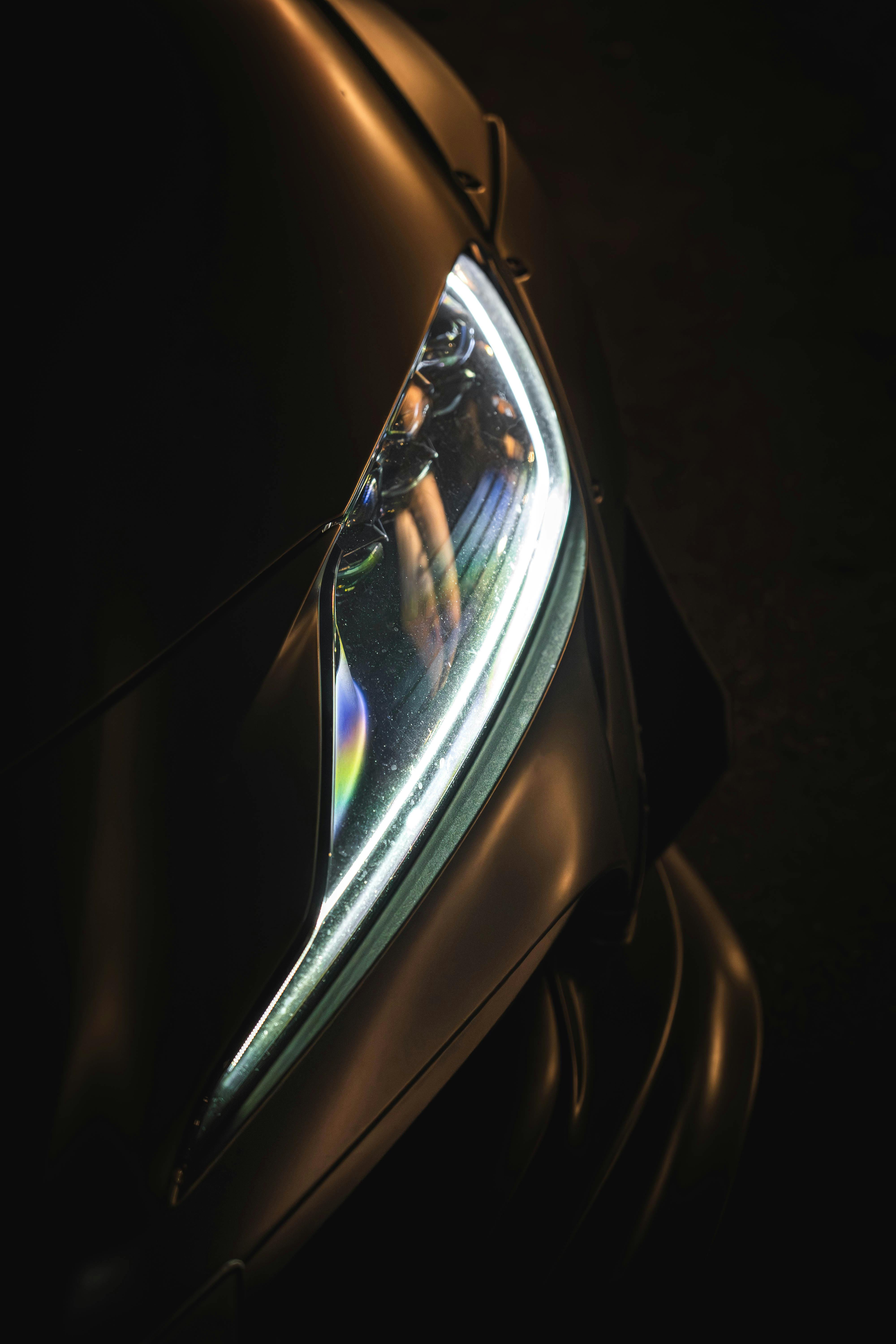 Illuminated Car Headlight · Free Stock Photo