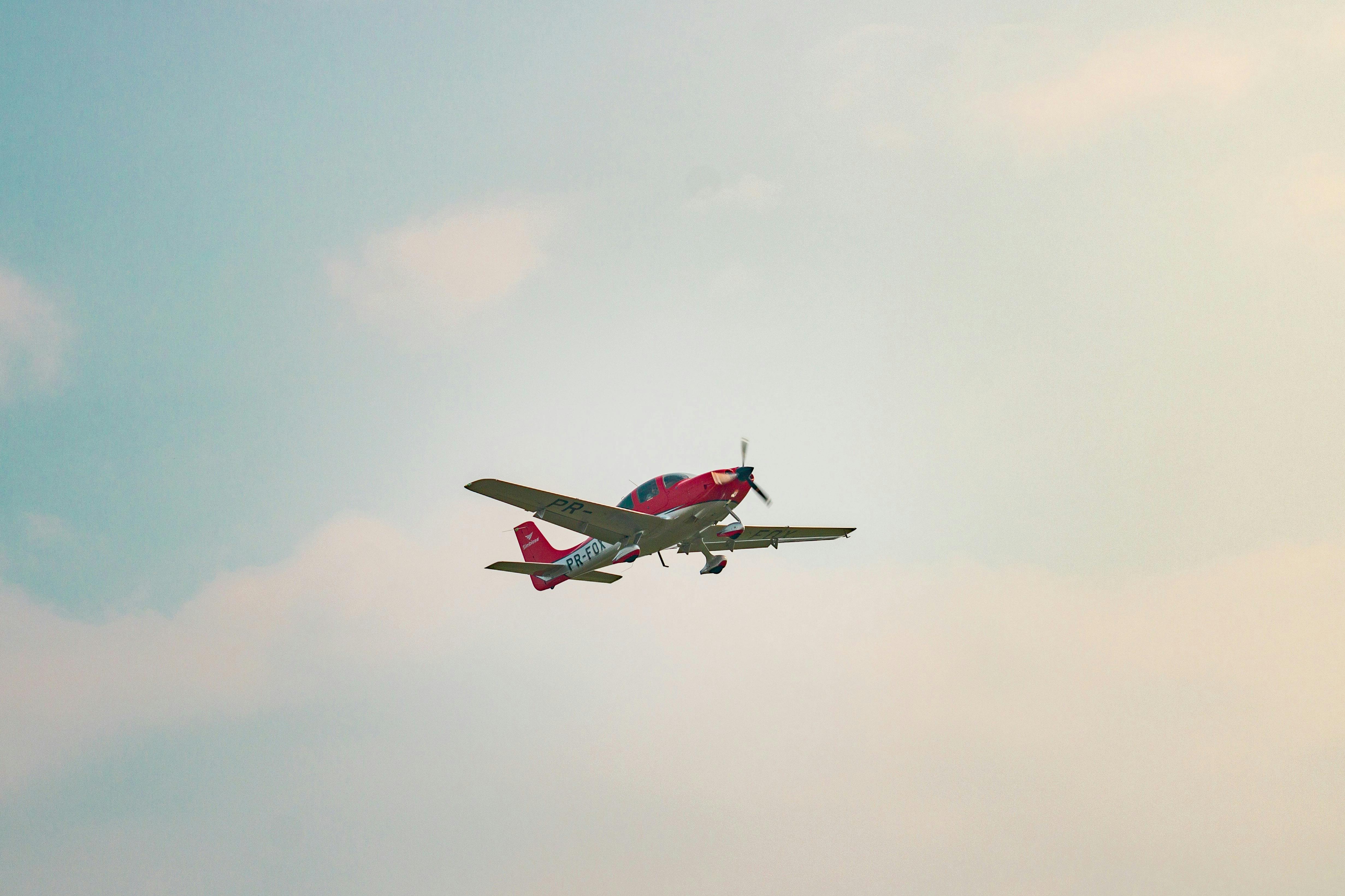 Flying Cirrus SR22 Plane · Free Stock Photo