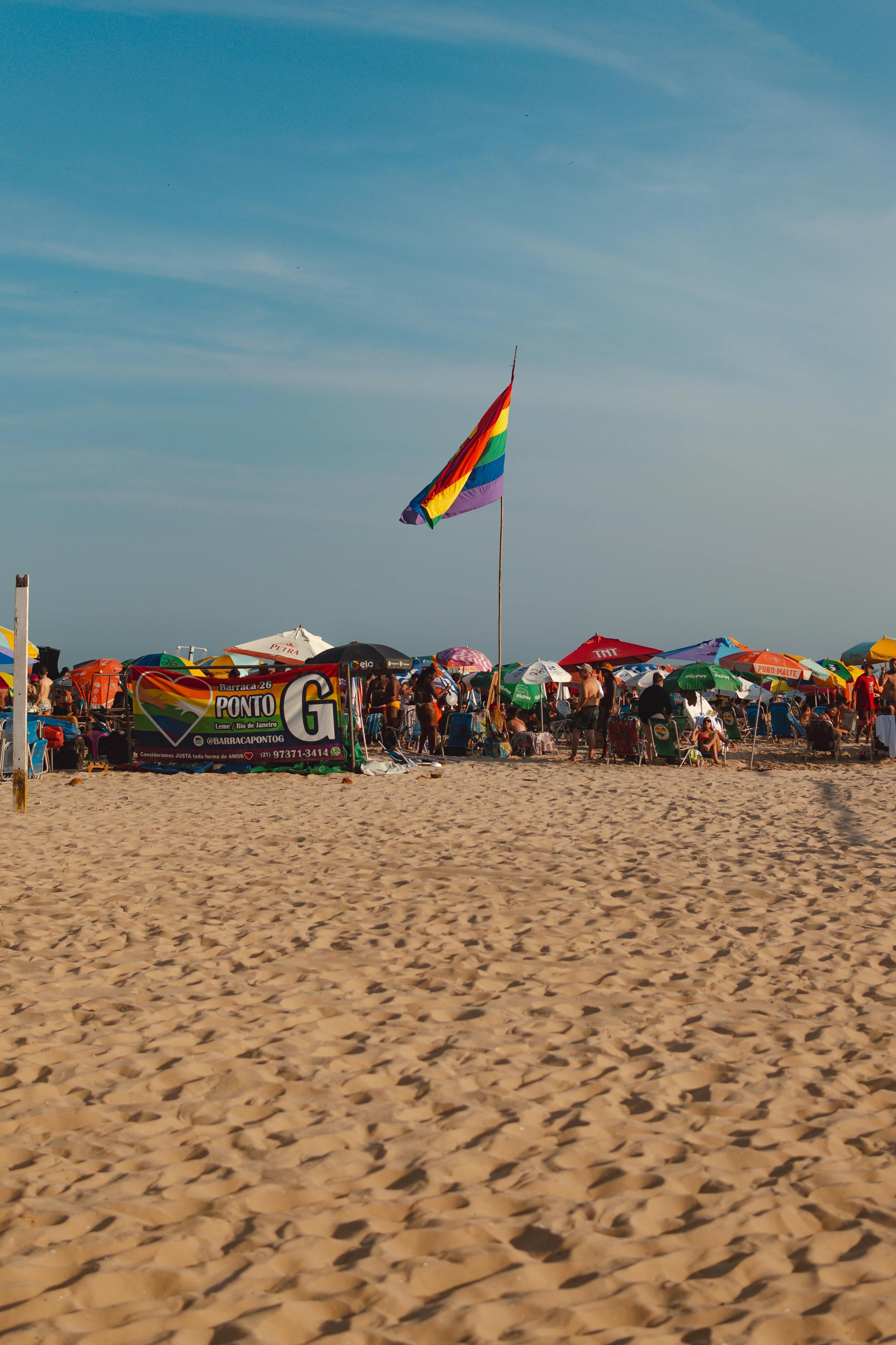 Rainbow Flag Waving over Beach in Rio de Janeiro, Brazil · Free Stock Photo