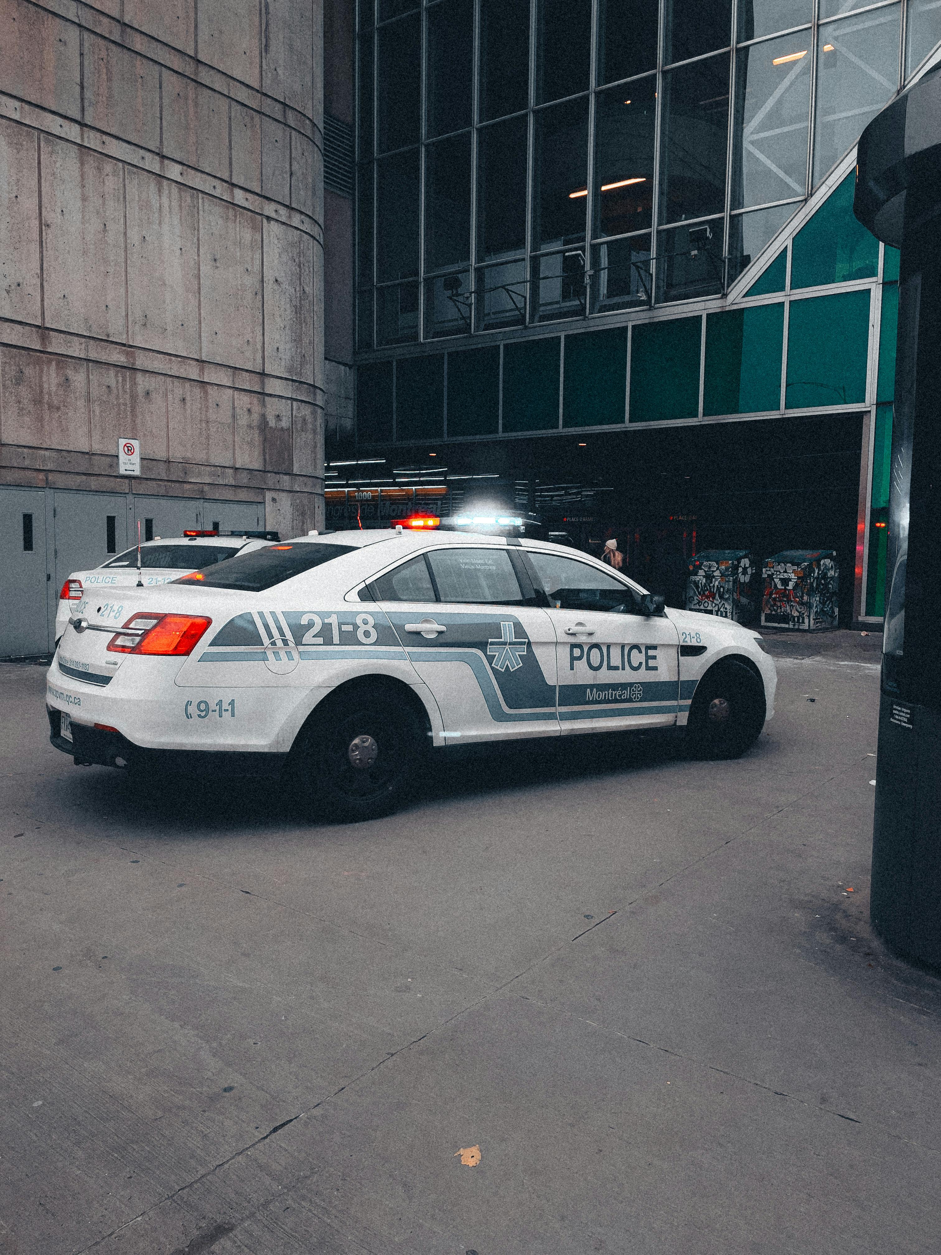 Police Car Behind Barricade Tapes · Free Stock Photo