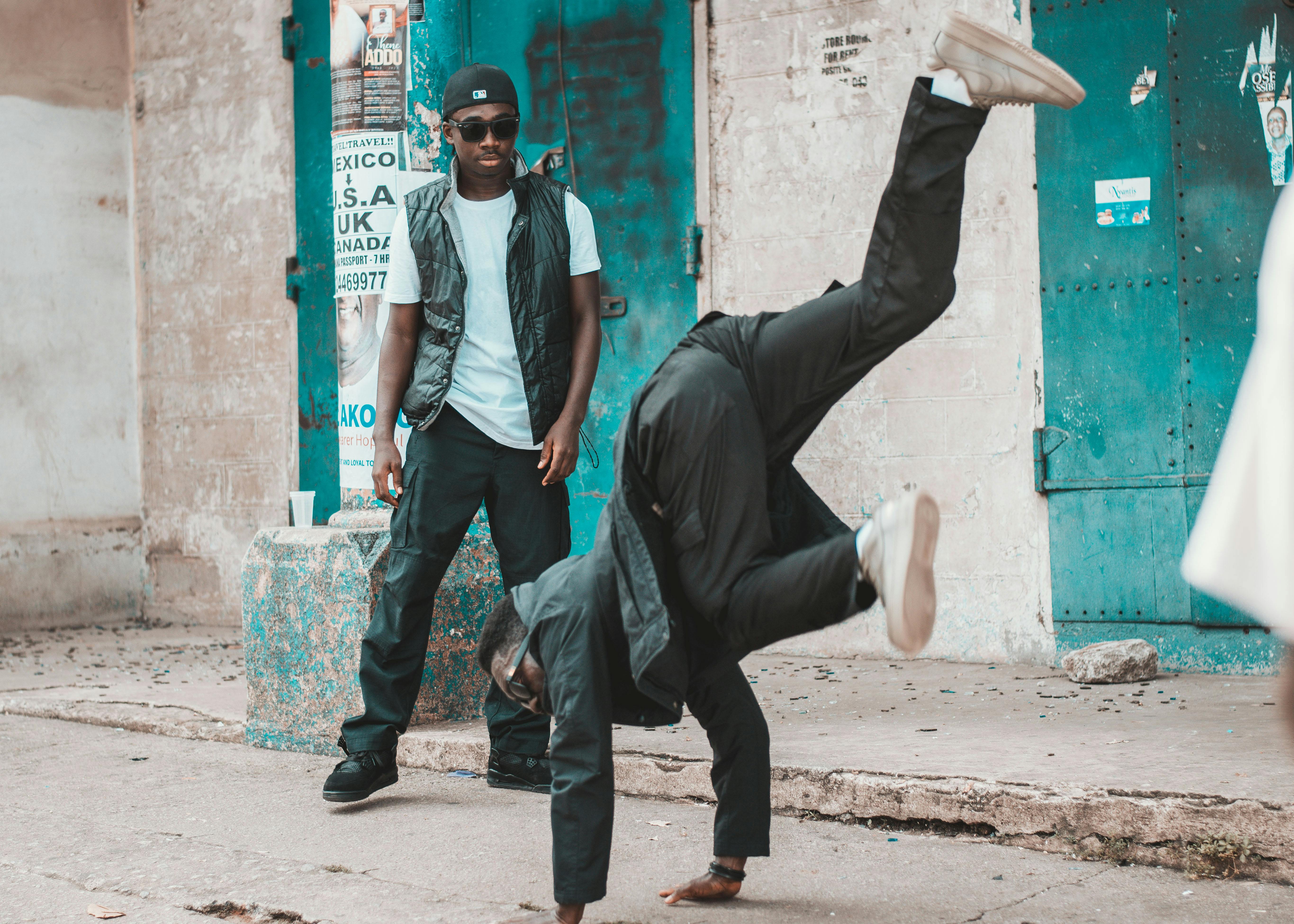 Men Breakdancing on a City Street · Free Stock Photo