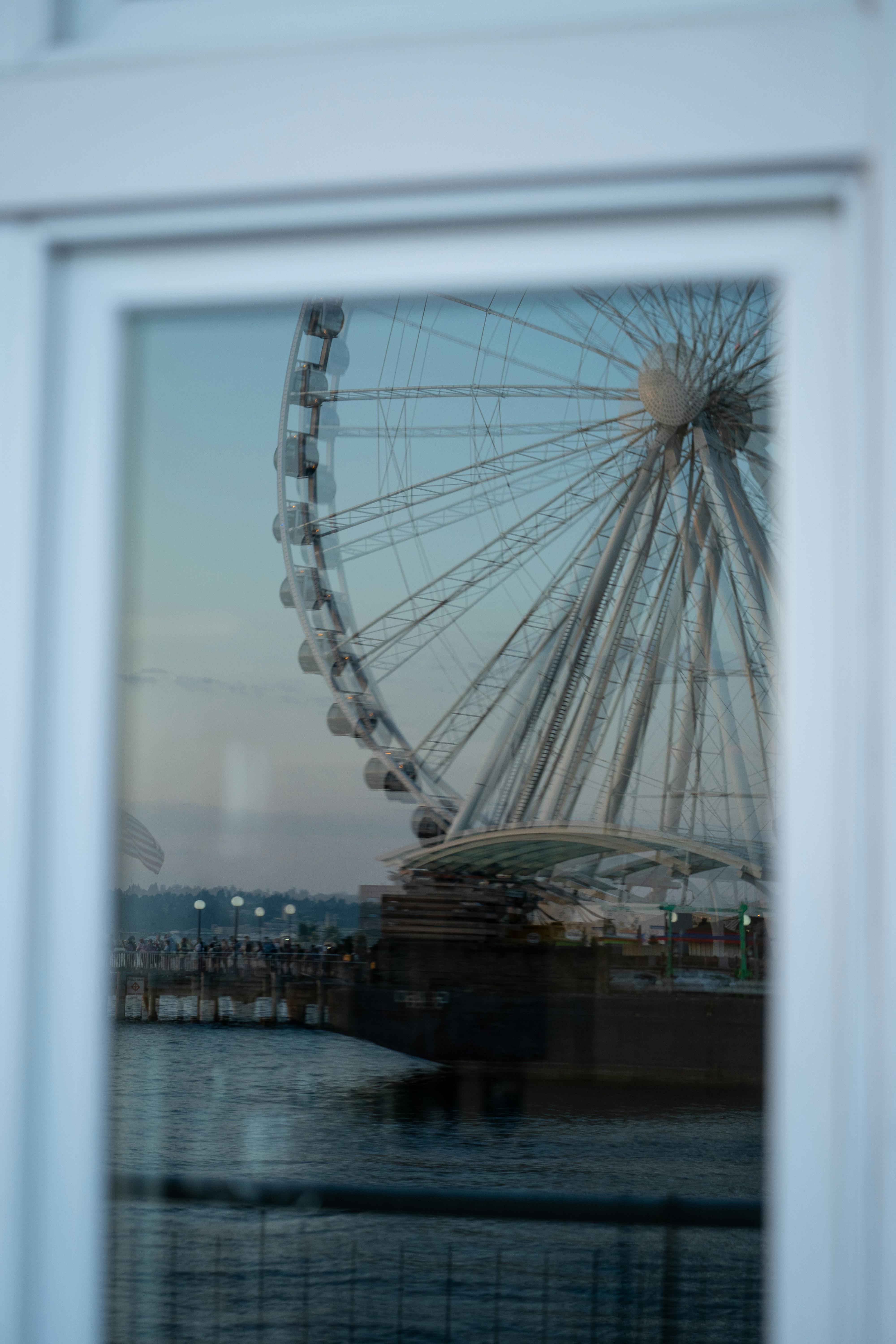 Reflection of a Ferris Wheel in a Window · Free Stock Photo