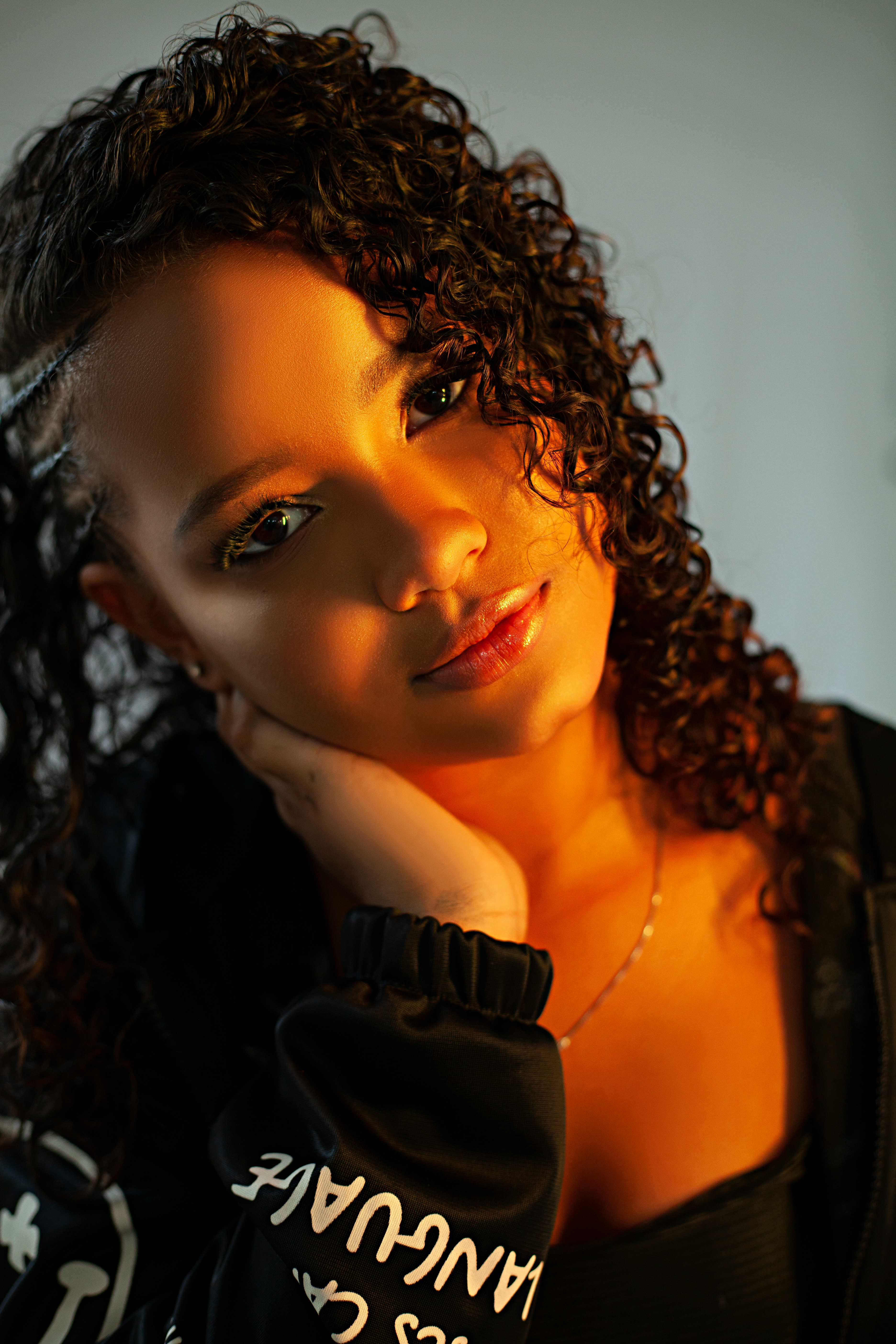 Studio Portrait of a Young Woman in Warm Lighting · Free Stock Photo